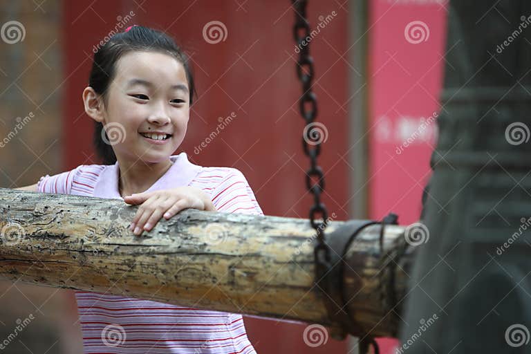 Child ringing bells stock image. Image of china, beautiful - 23741025