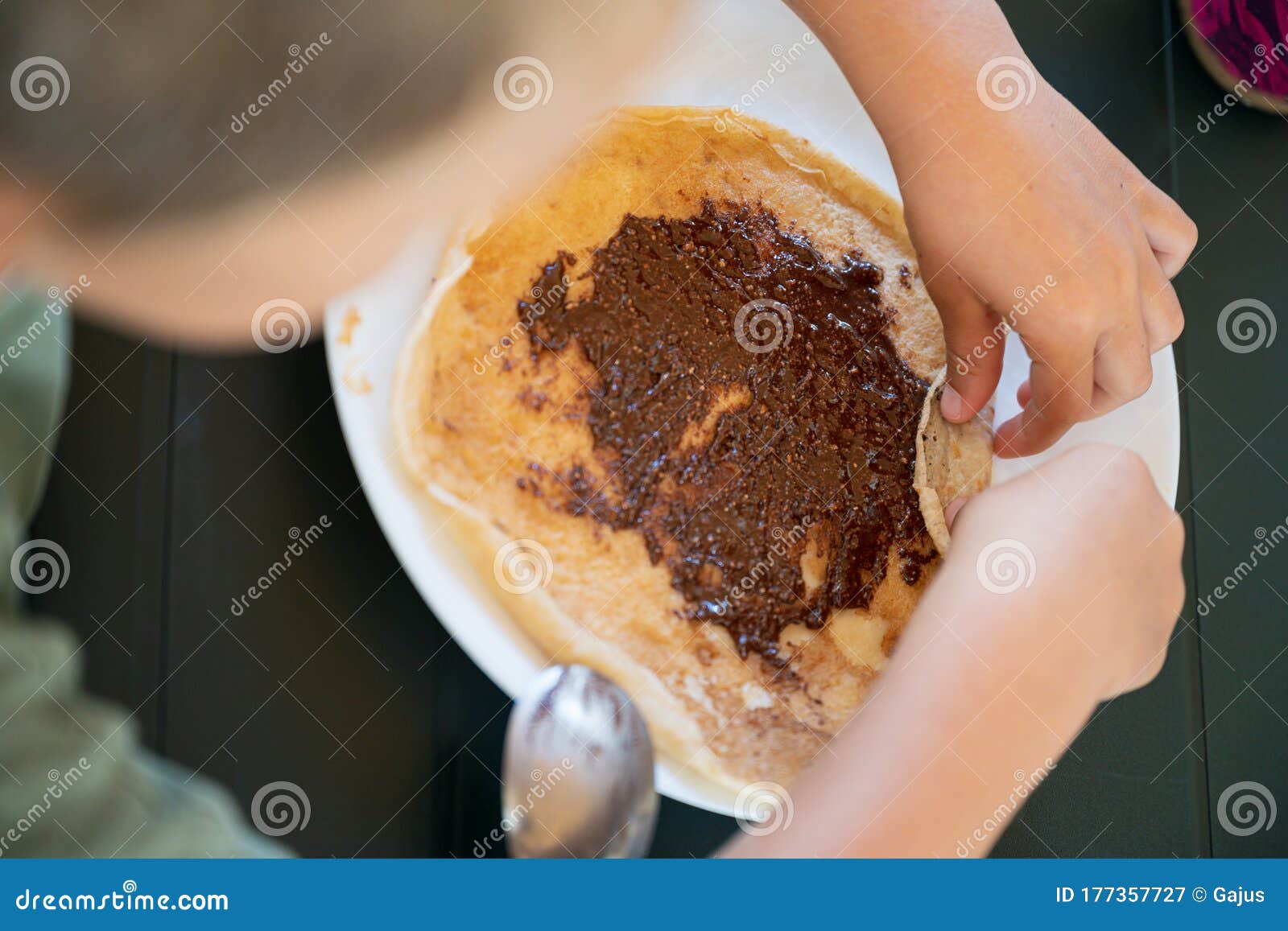 Child Rolling a Chocolate Filled Crepe Stock Image - Image of brunch ...