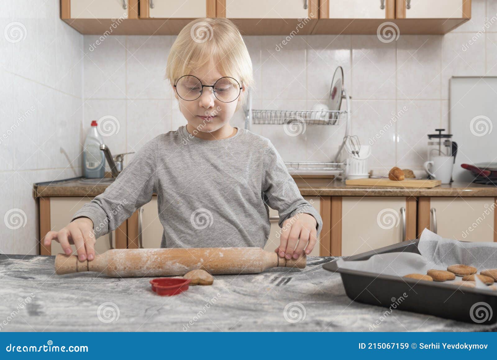 Child with Rolling Pin in His Hands Rolls Out the Cookie Dough Stock ...