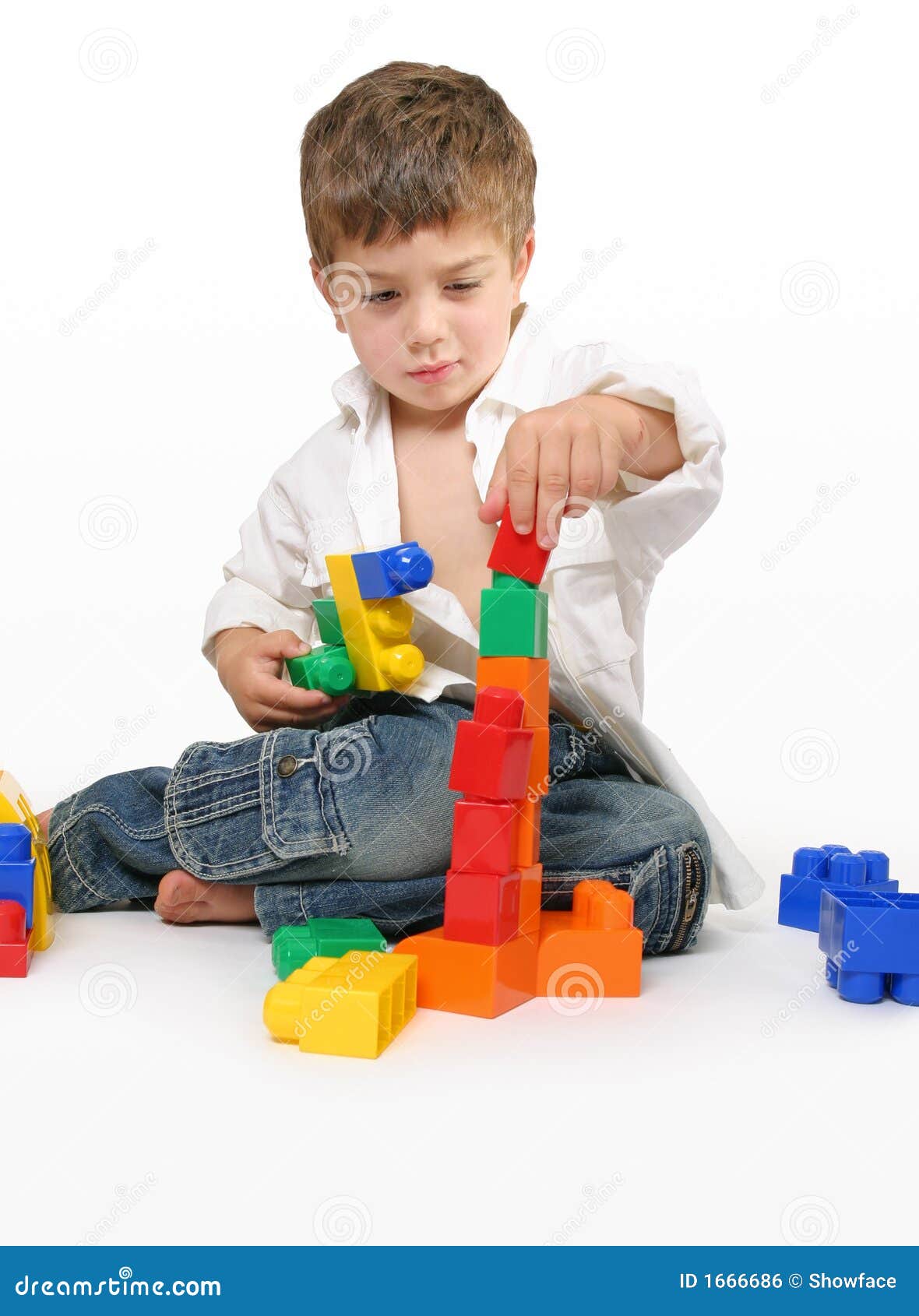 Child s concentration stock photo. Image of sitting, playing - 1666686