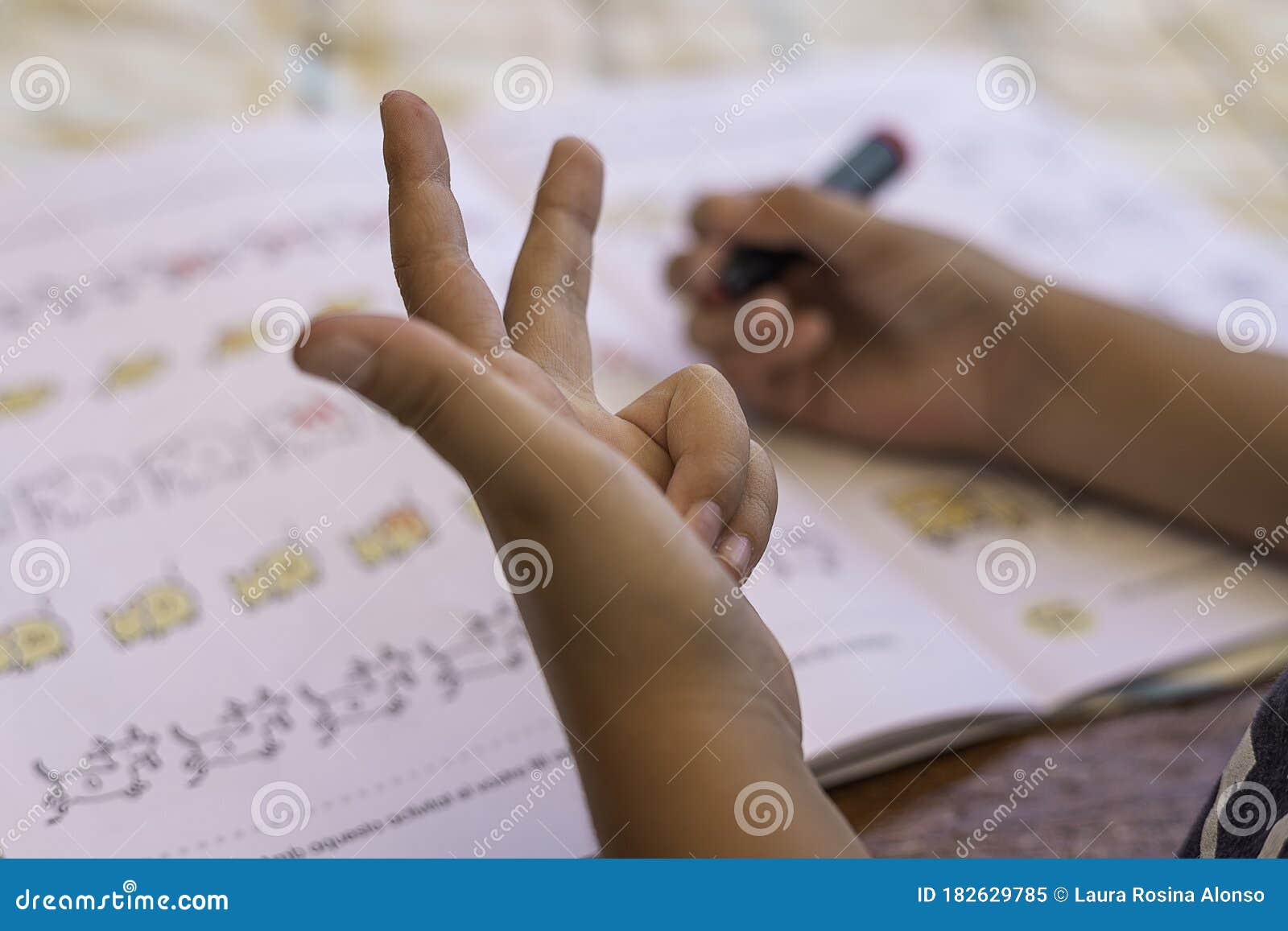 Child`s Hand Doing Math while Counting on Fingers Stock Image - Image ...