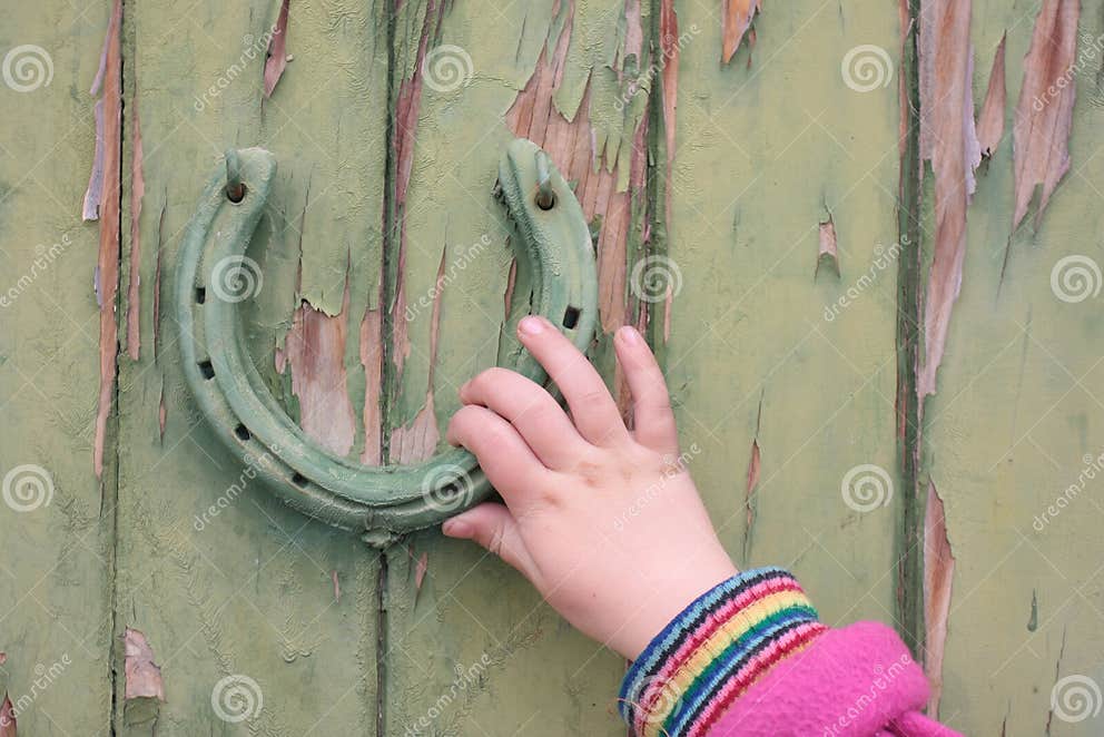Child S Hand on Door Knocker Stock Photo - Image of wooden, entrance ...