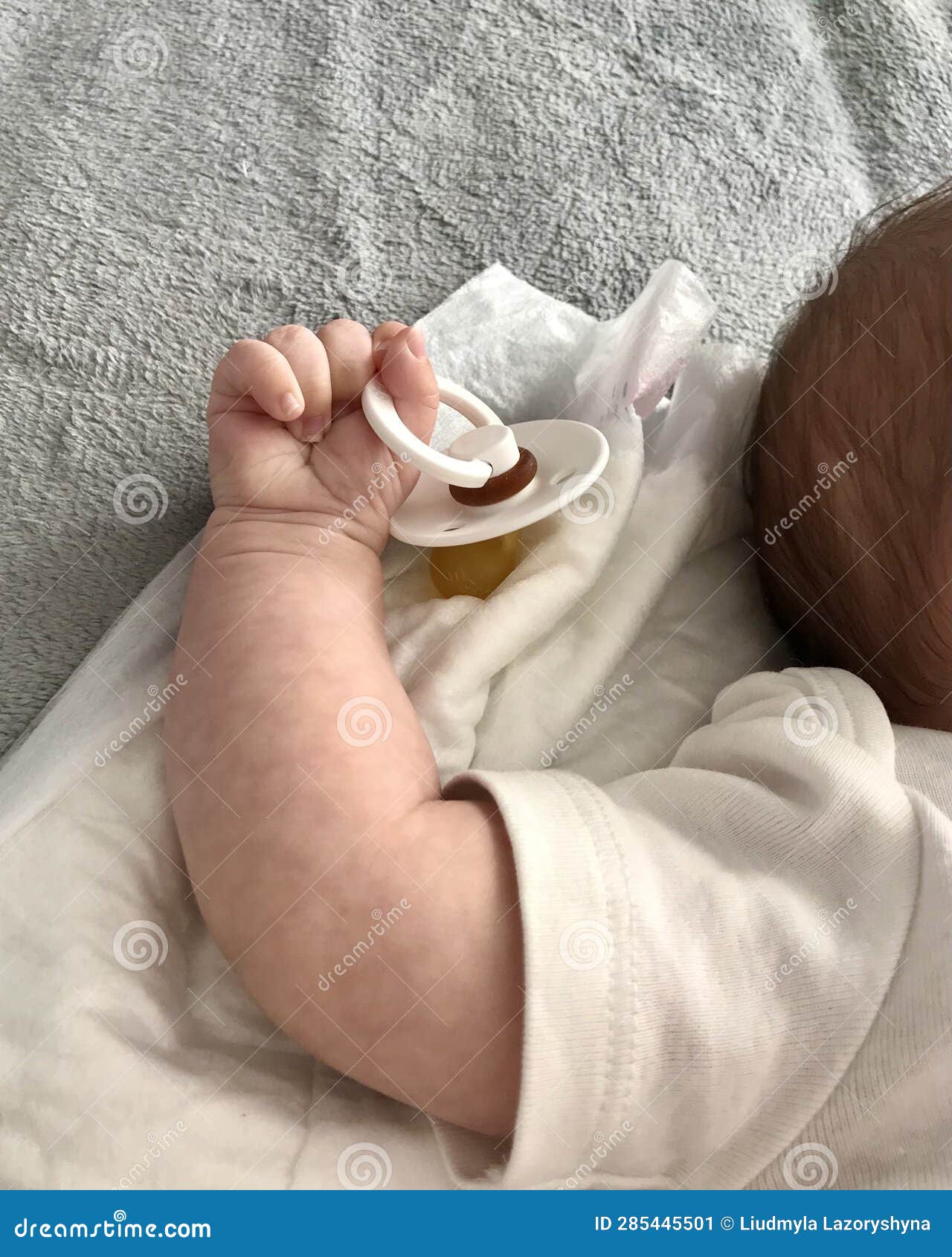 Child S Hand of a Newborn Baby Holding a Pacifier Stock Image - Image ...