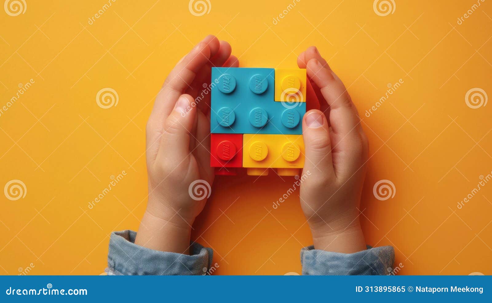 A Child S Hand Playing with Lego. There are Legos Scattered on the ...