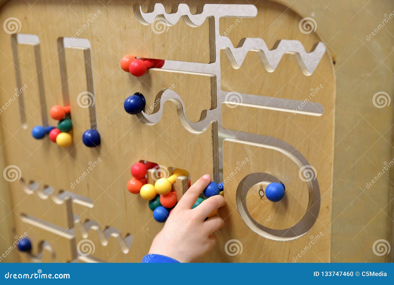 Child`s Hand Plays with Wooden Puzzle Stock Photo - Image of education ...