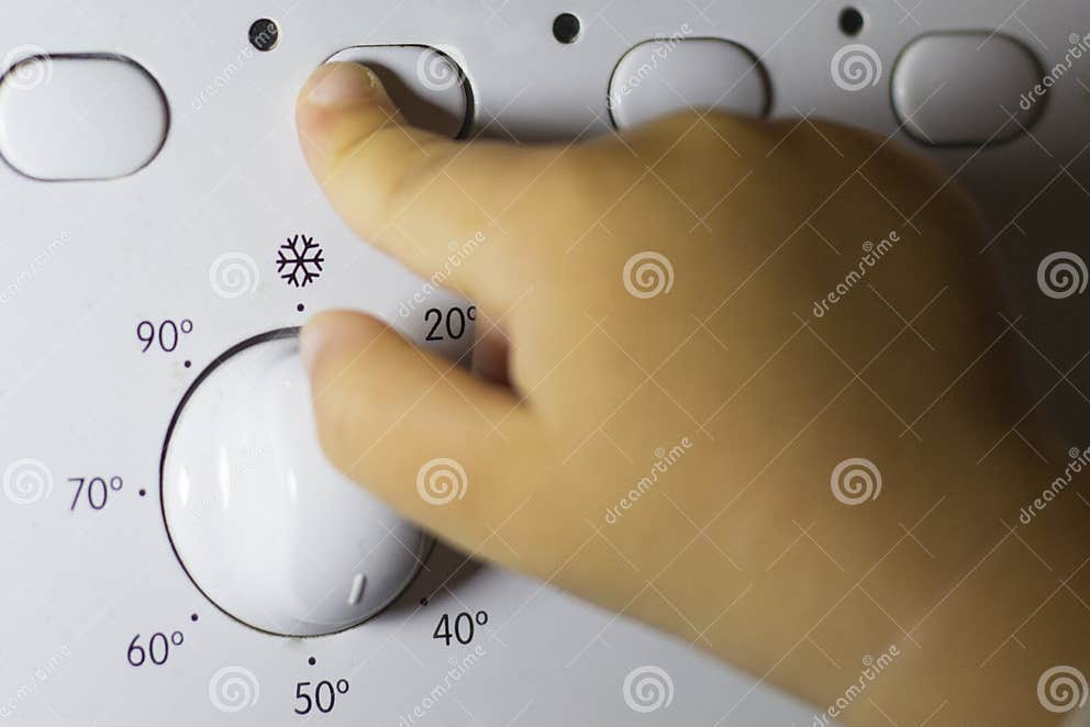 A Child& X27;s Hand Presses a Button on a Washing Machine Stock Image ...