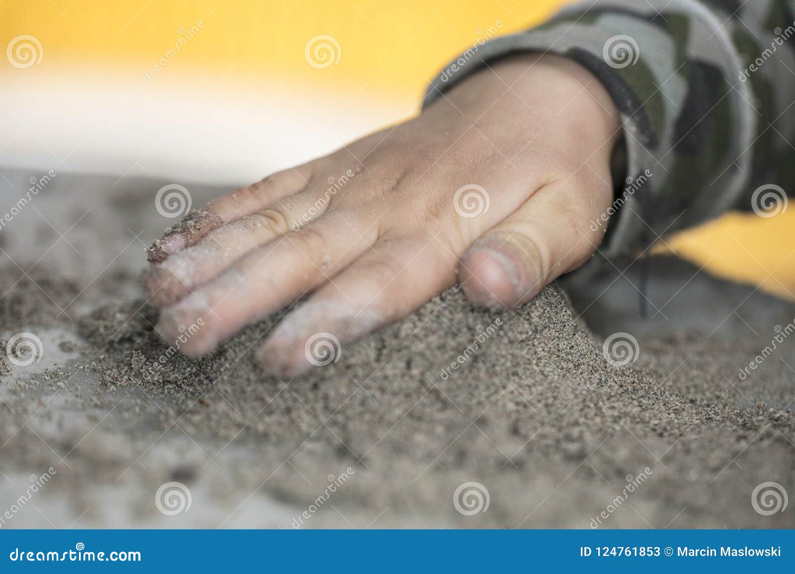 Child`s hand on the sand stock image. Image of sand - 124761853