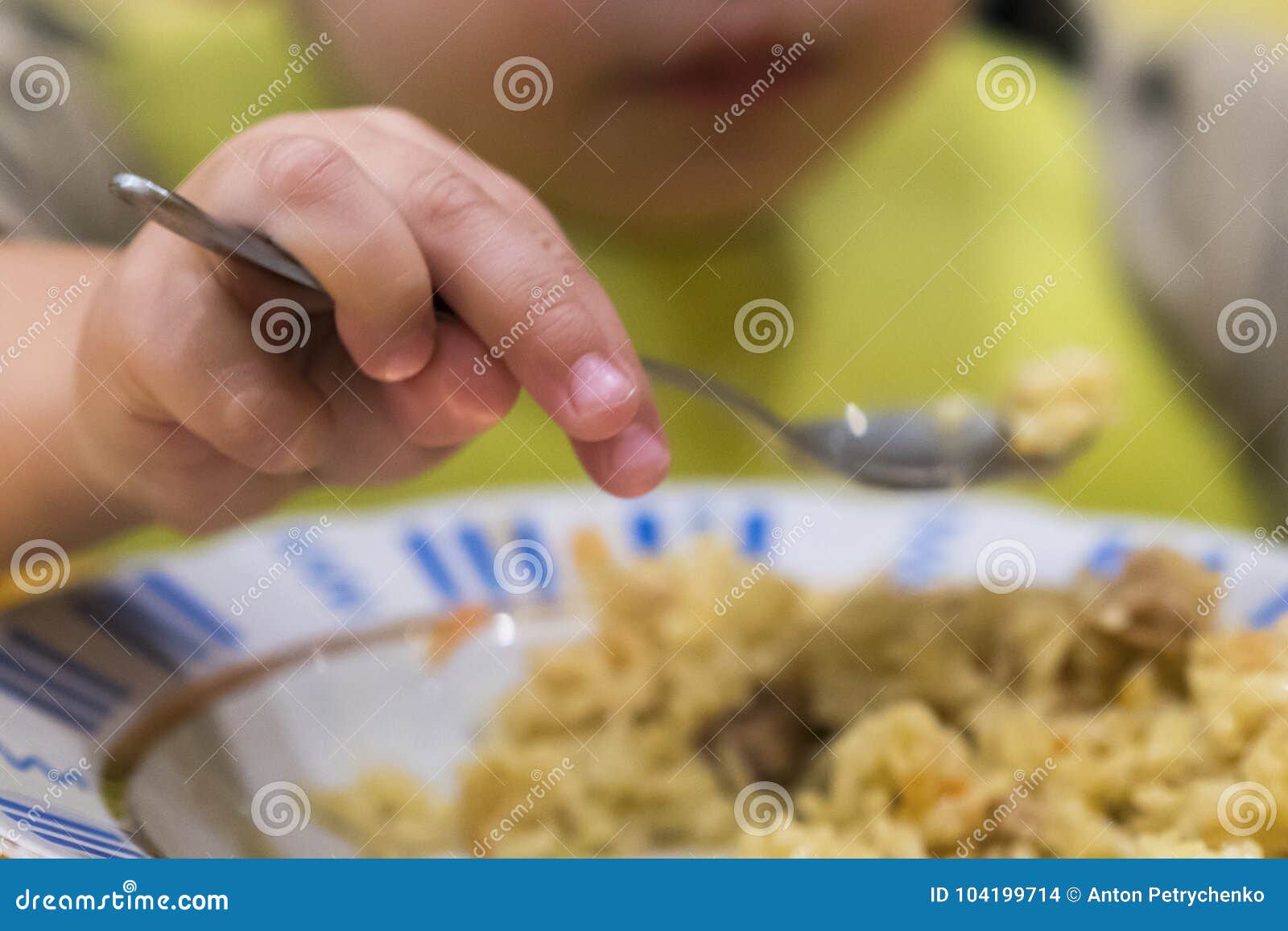 Child`s hand with a spoon stock photo. Image of family - 104199714