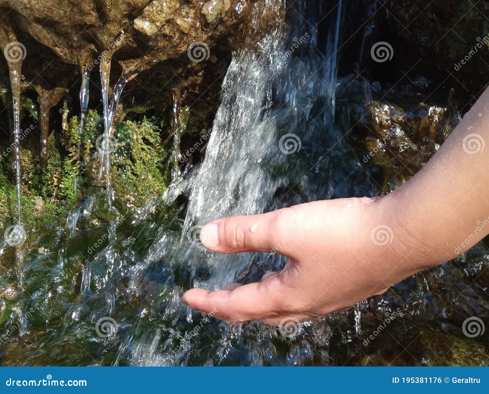 A Child& X27;s Hand in the Stream of a Mountain Stream Stock Photo ...