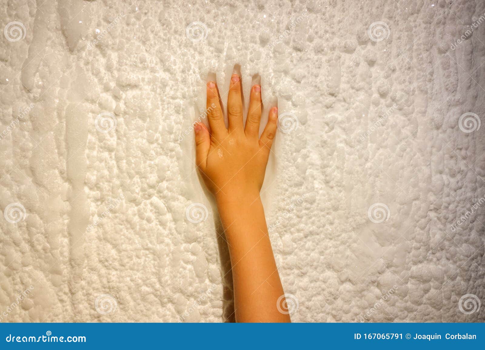 A Child`s Hand Touching the Frozen Ground Full of Ice Stock Image ...