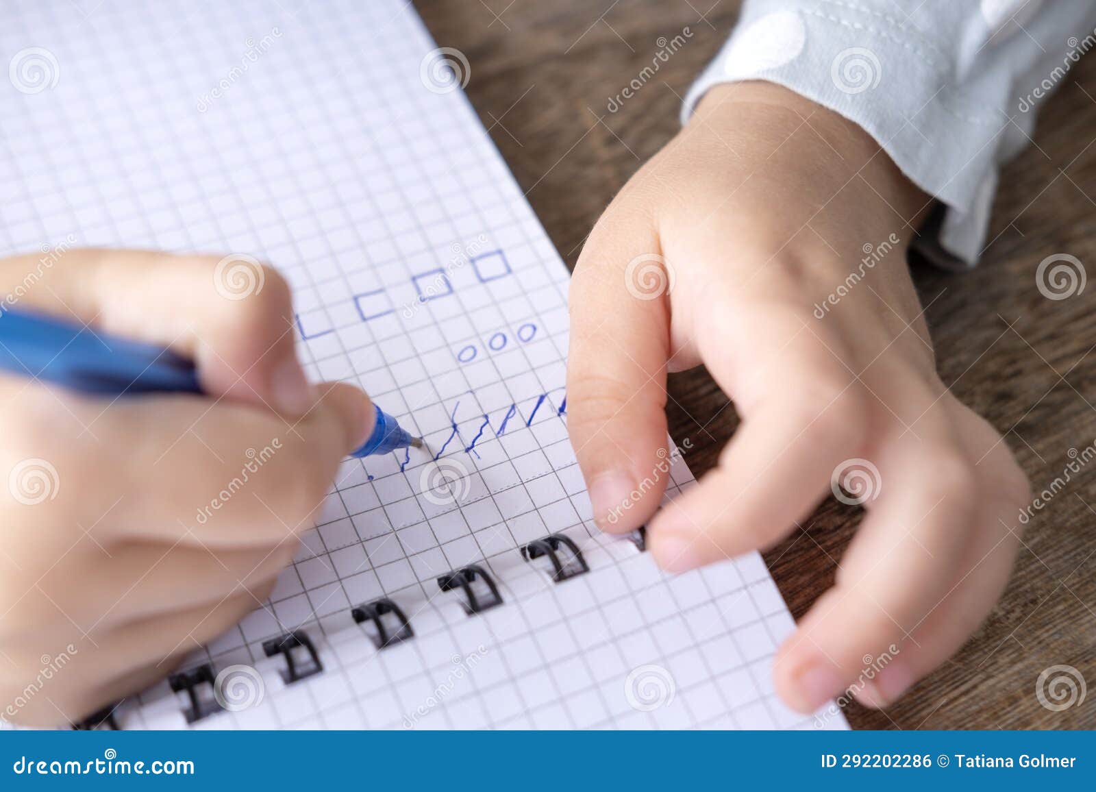 Child S Hand Writes with Pen in Notebook, Practicing Handwriting for ...