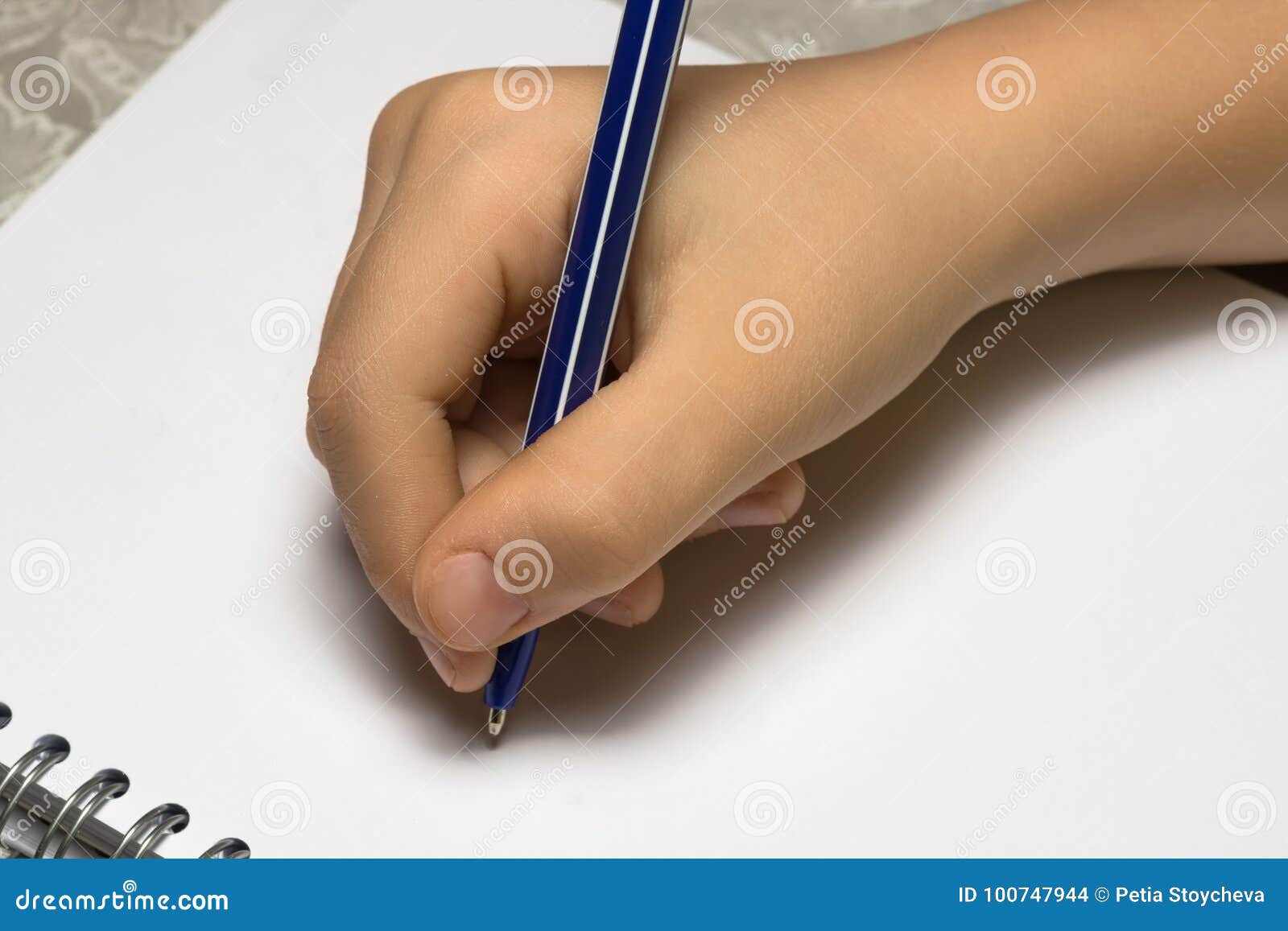 Child`s Hand Writing on a White Sheet of Notebook Stock Photo - Image ...