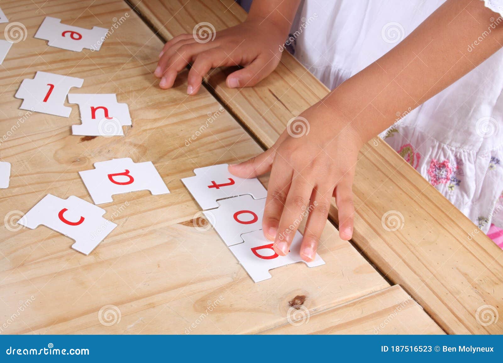 A Child`s Hands Moving Letters To Make a Word Stock Image - Image of ...