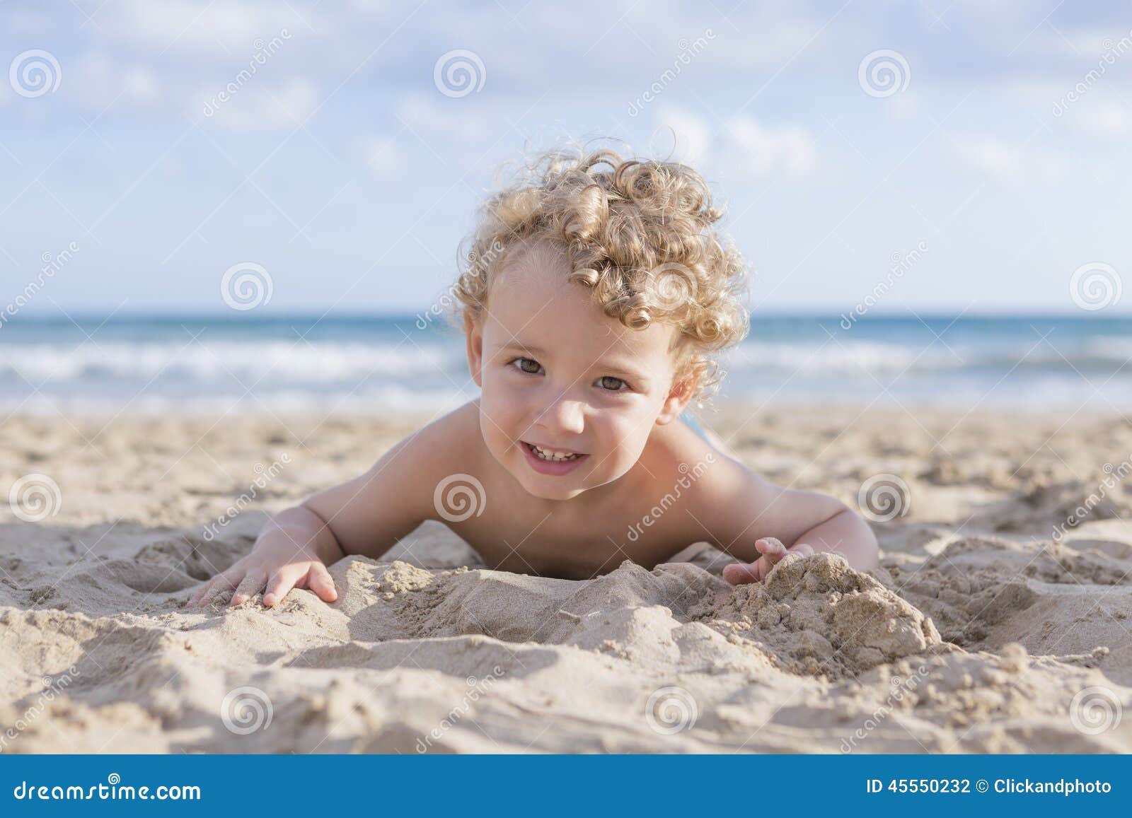 Child in the sand stock photo. Image of summertime, water - 45550232