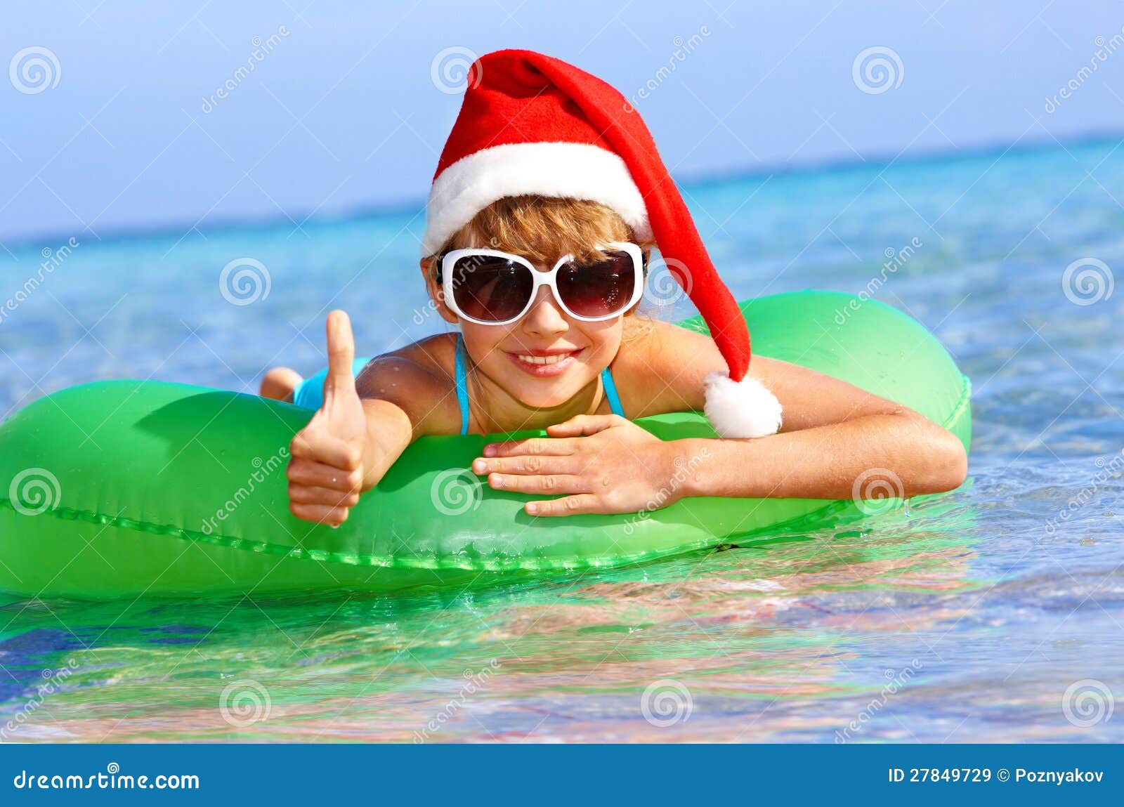 Child in Santa Hat Floating at Sea. Stock Image - Image of santa ...