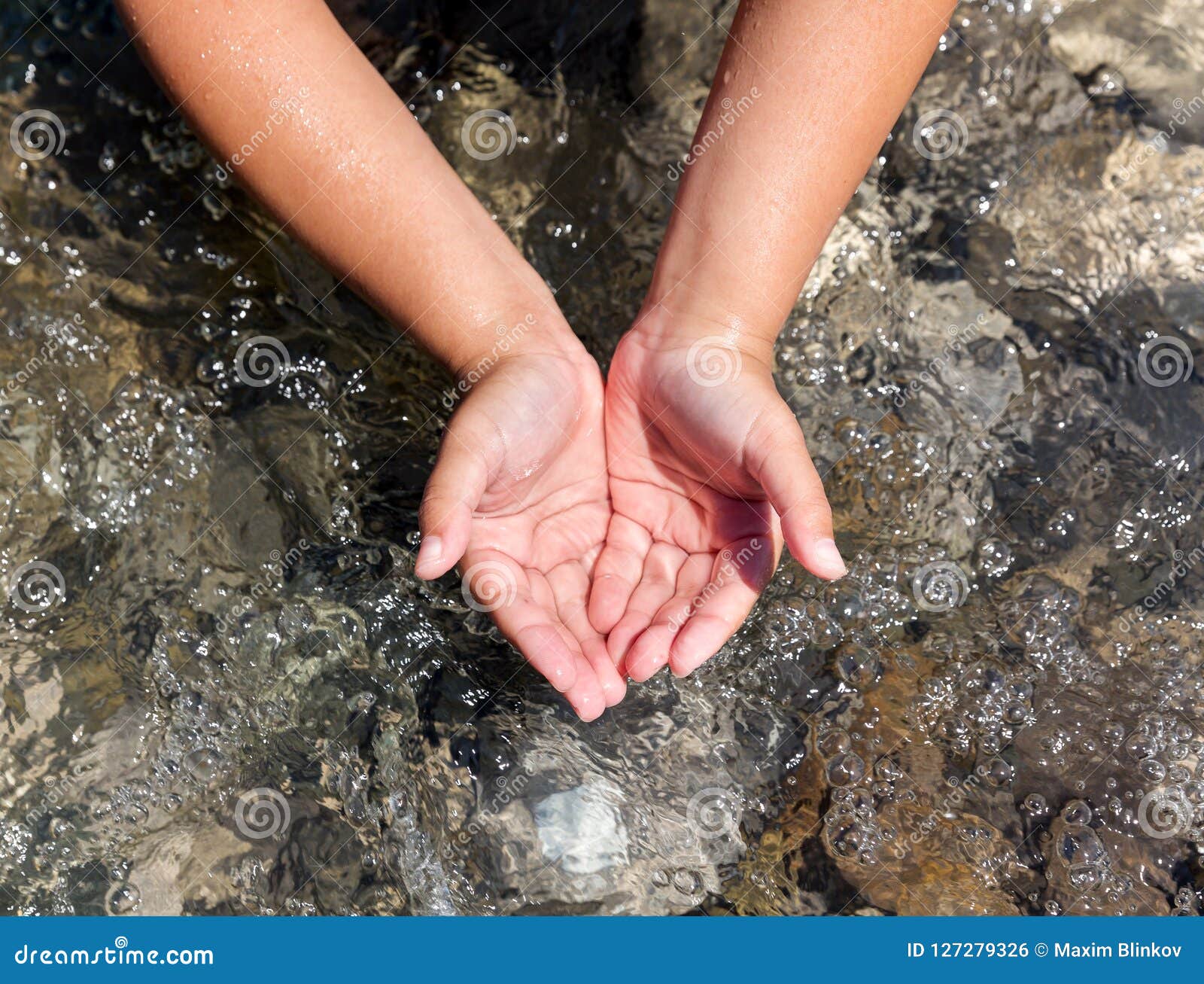 Child scoops up water stock photo. Image of purity, pure - 127279326