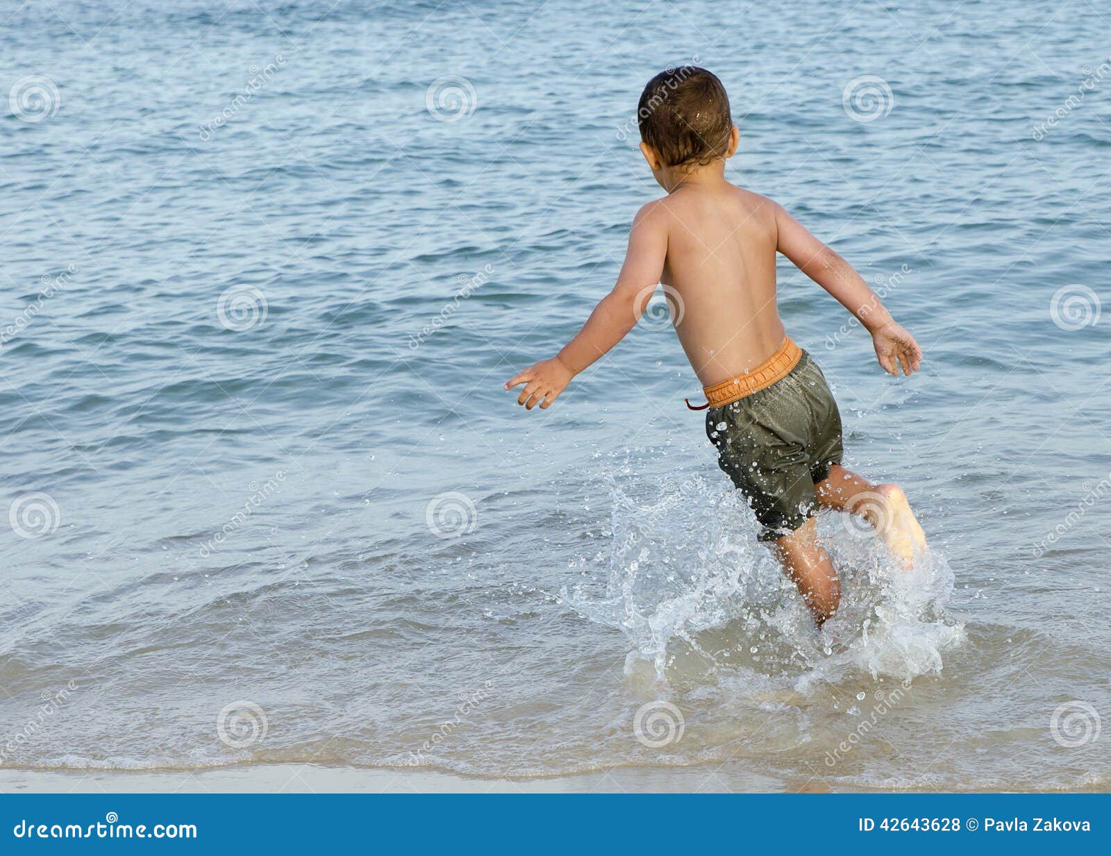 Child in sea on beach stock photo. Image of little, children - 42643628