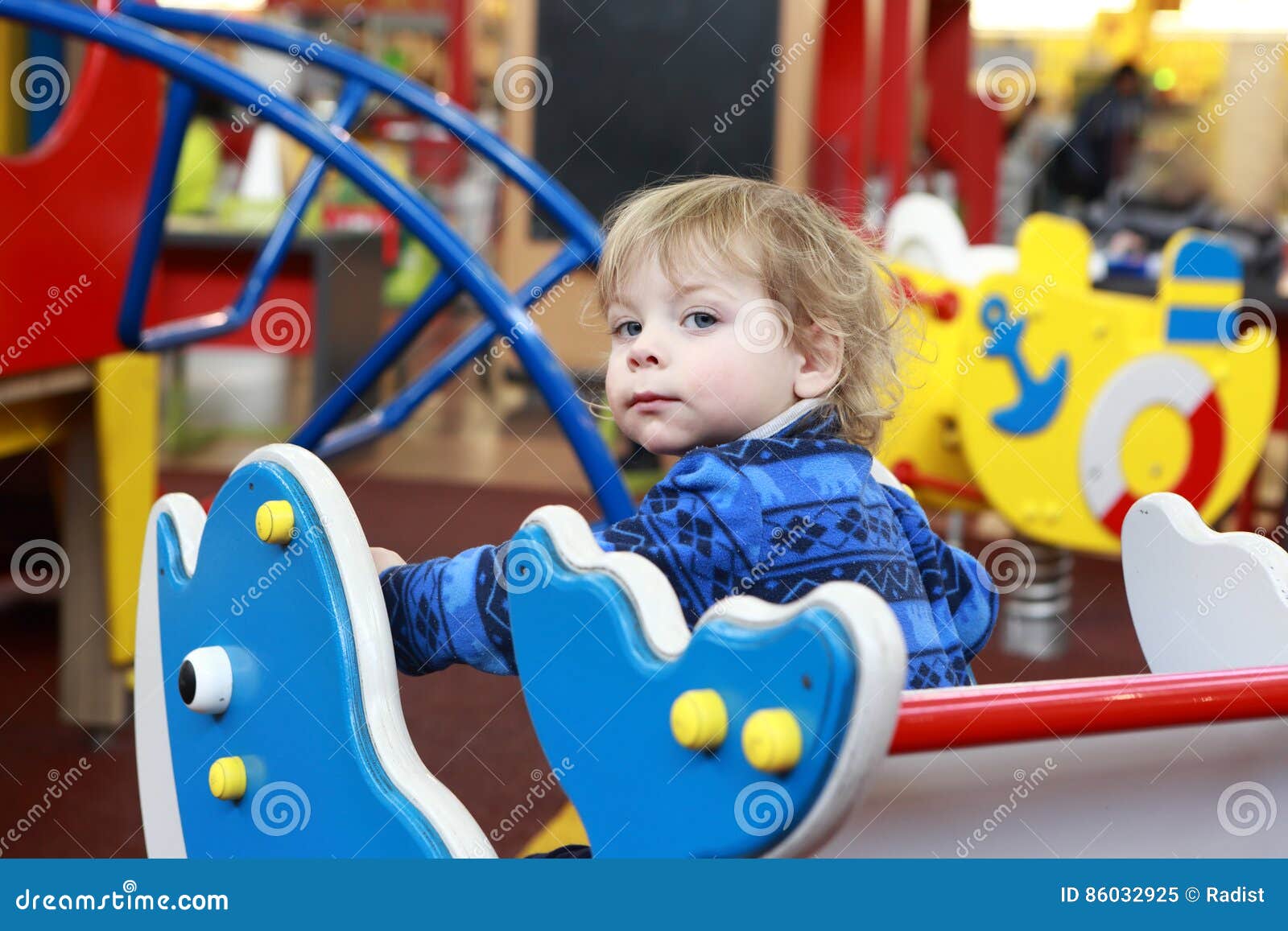 Child Shaking at Indoor Playground Stock Image - Image of portrait ...