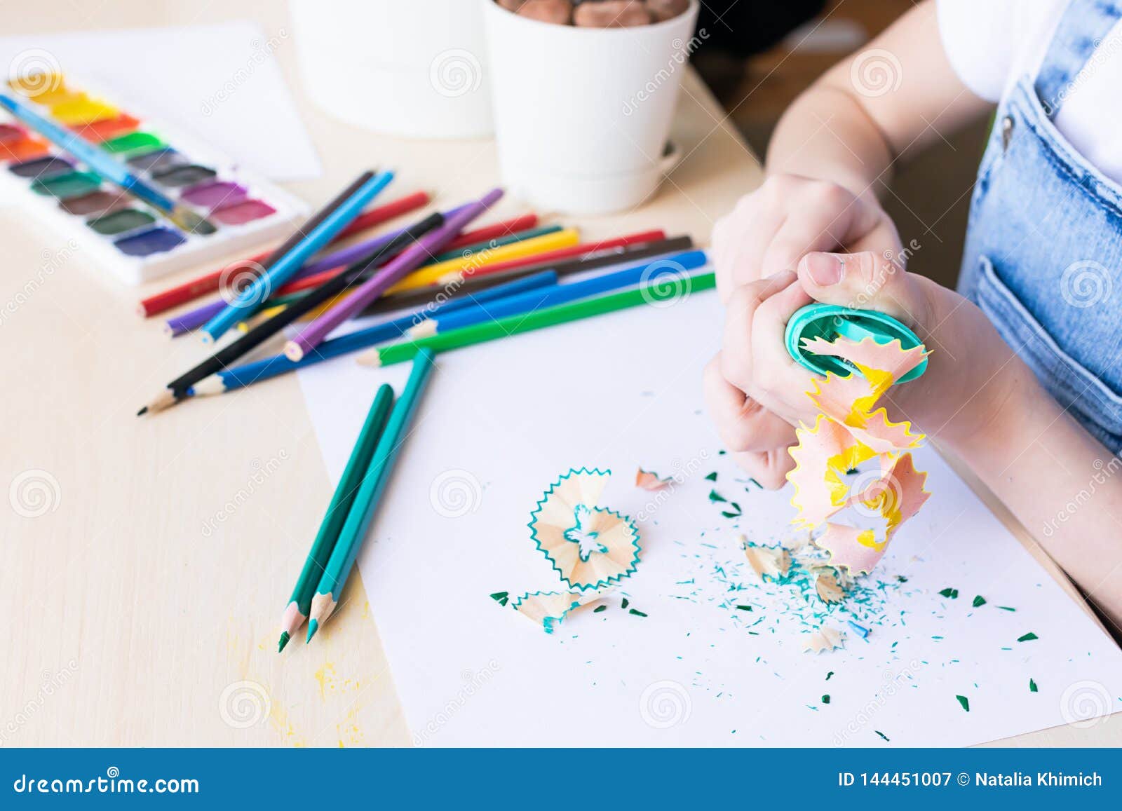 The Child Sharpens Colored Pencils, Preparation for Drawing. School ...