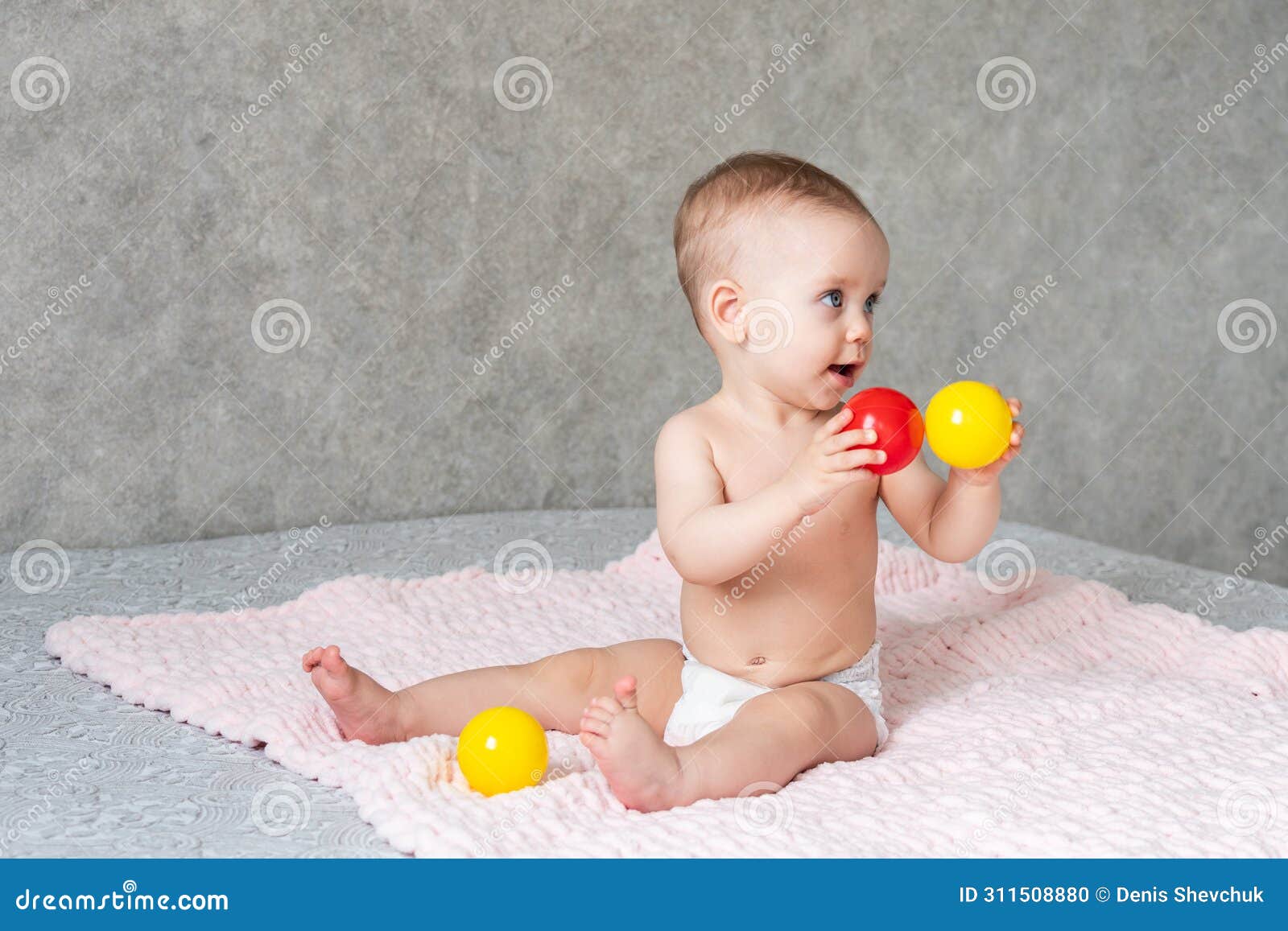 A Child Shows Someone the Colored Balls he Plays with Stock Photo ...