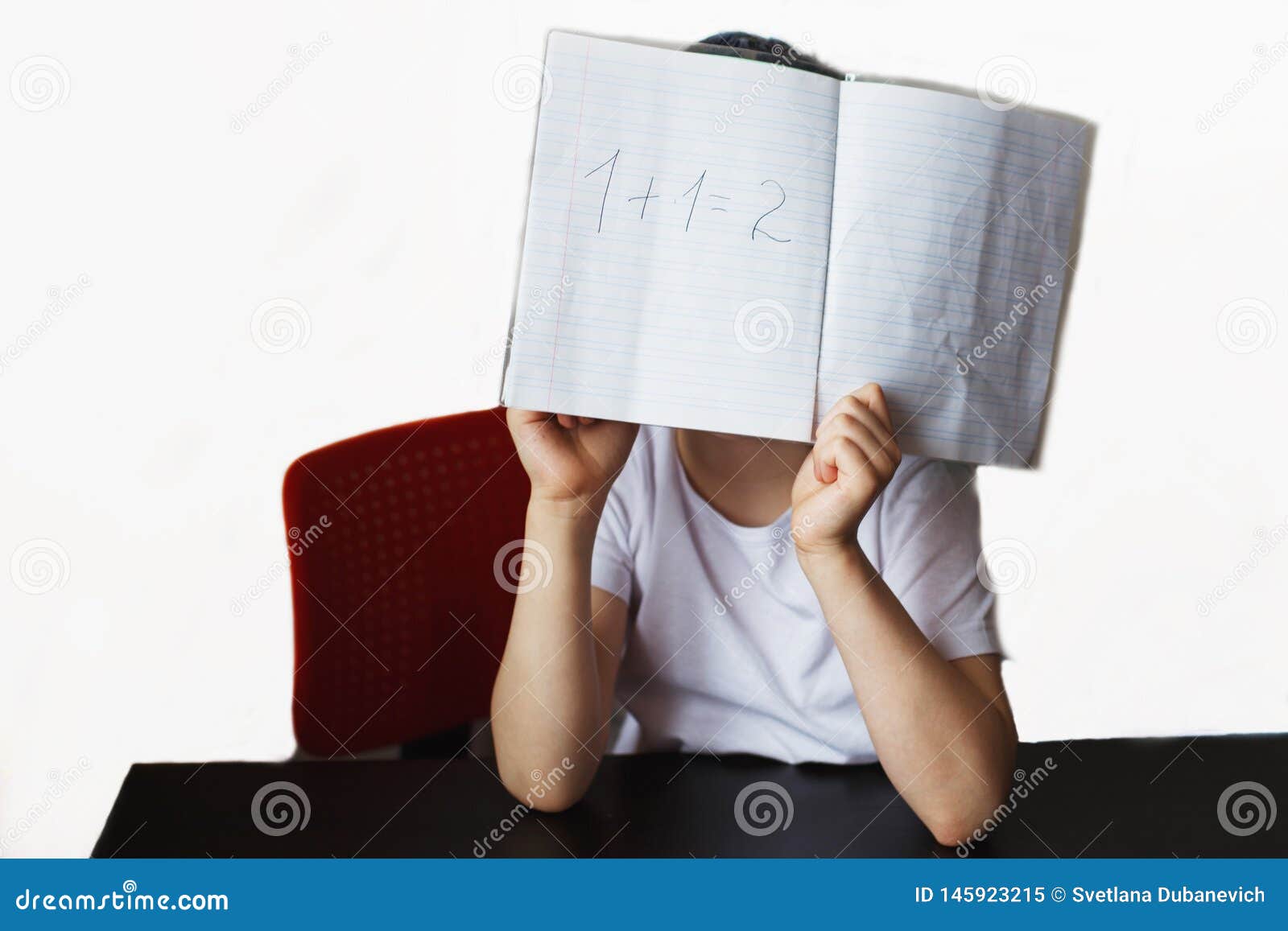 Child Sits and Does Homework on a White Background Stock Image - Image ...