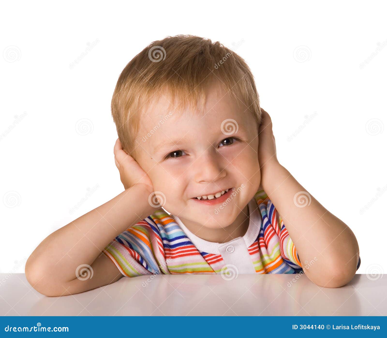 The child sits at a table stock photo. Image of playful - 3044140