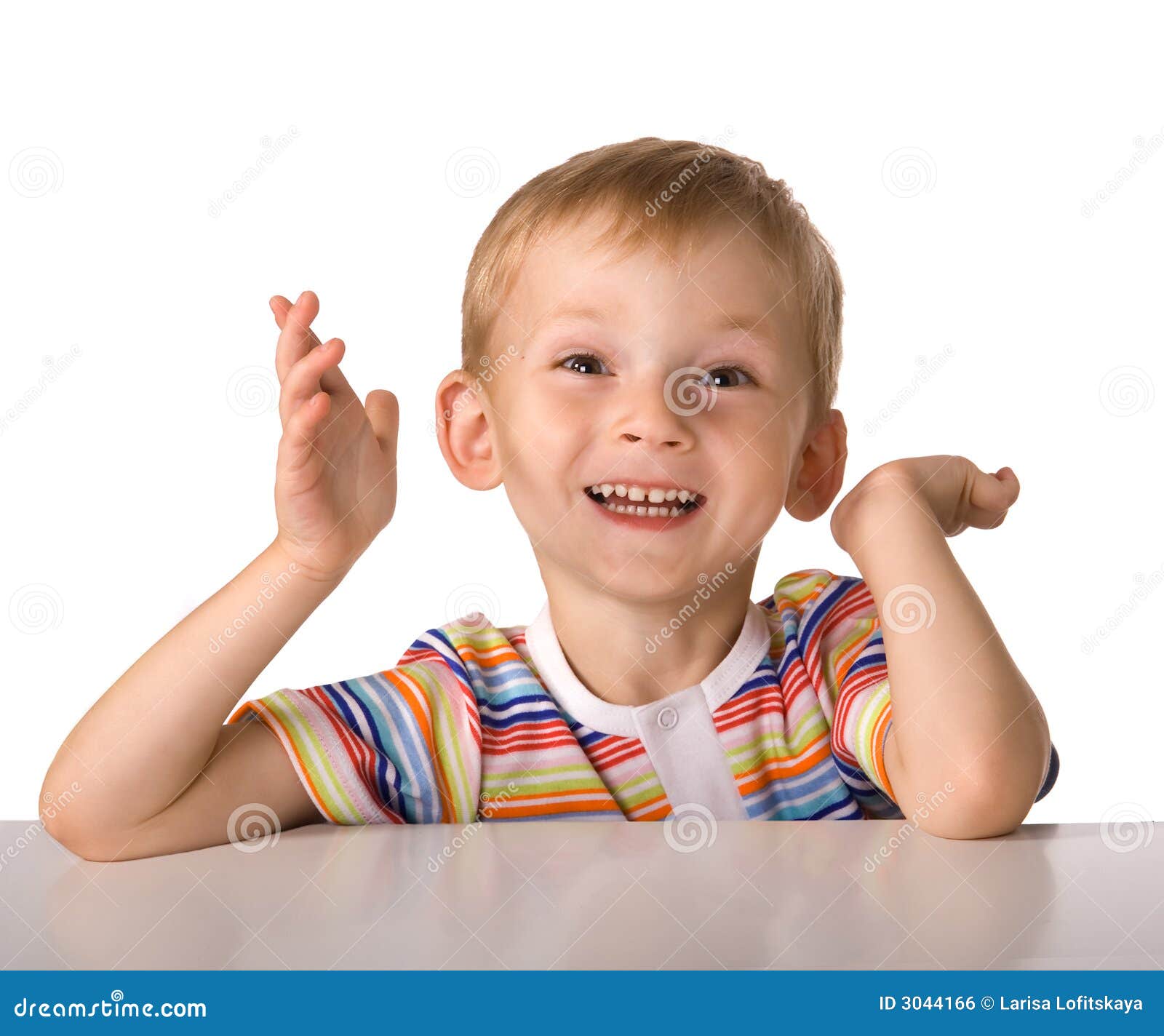 The child sits at a table stock photo. Image of expression - 3044166