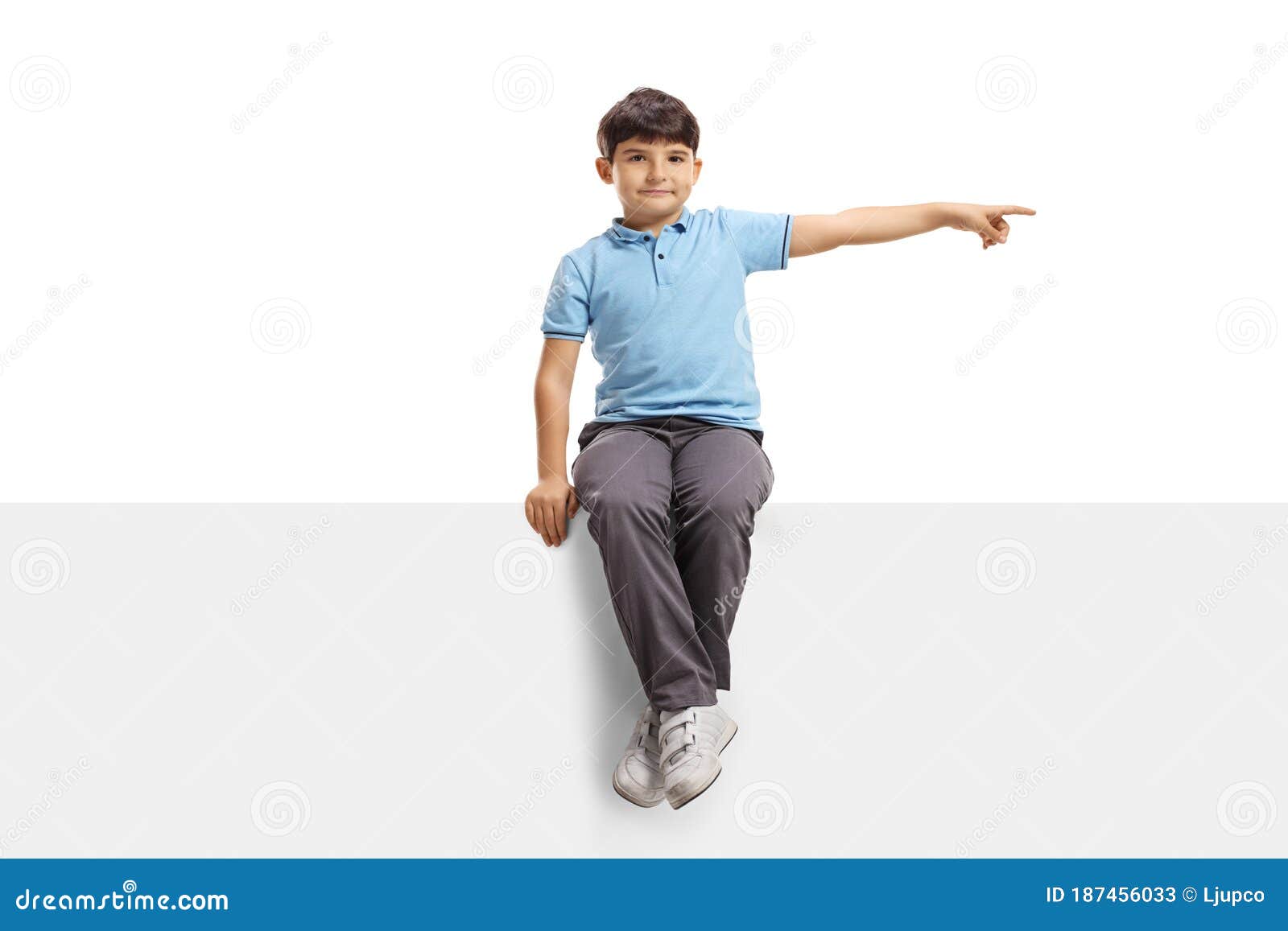 Child Sitting on a Blank Panel and Pointing To the Side Stock Image ...