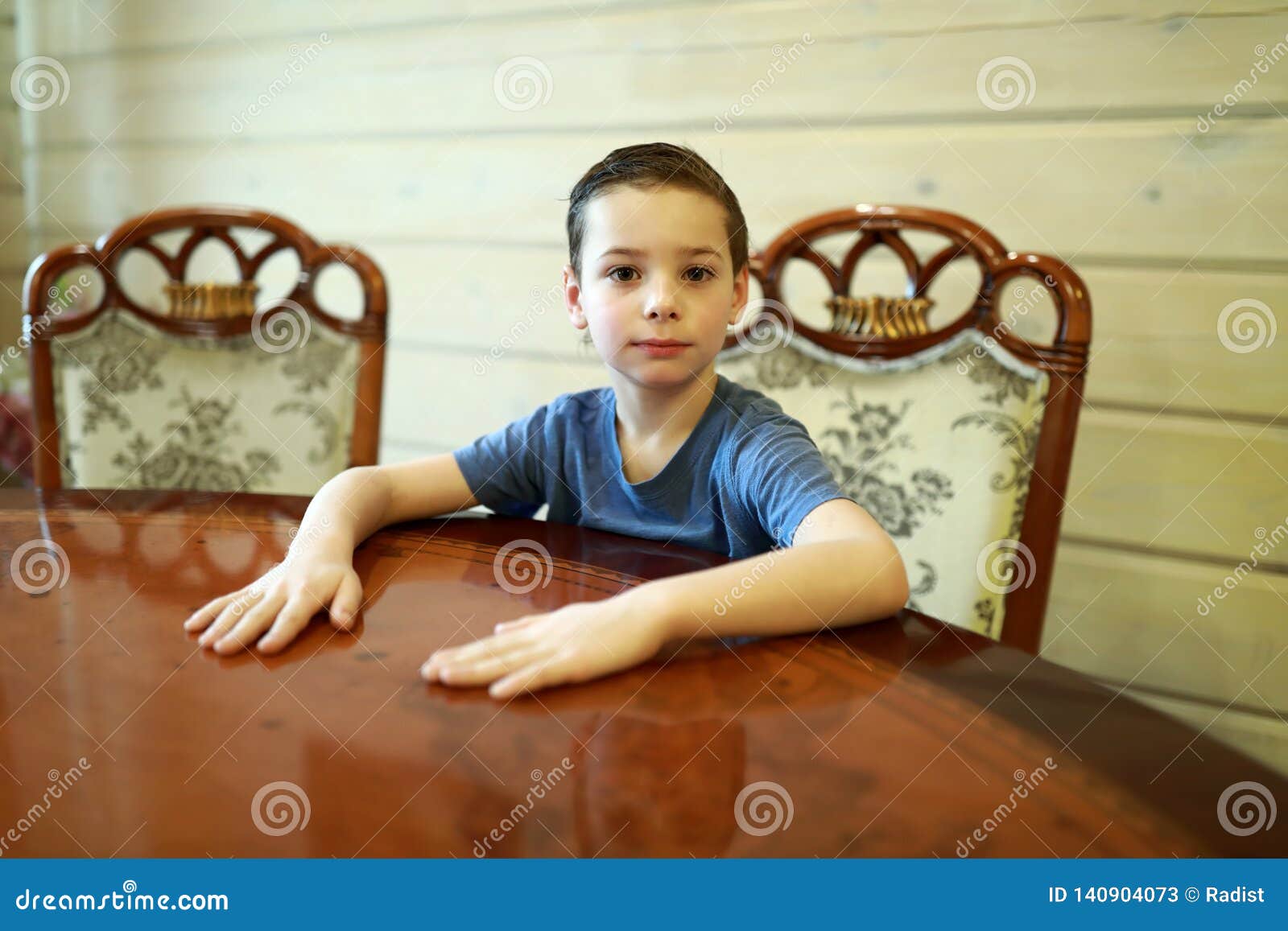Child Sitting at Round Table Stock Image - Image of innocence, relax ...