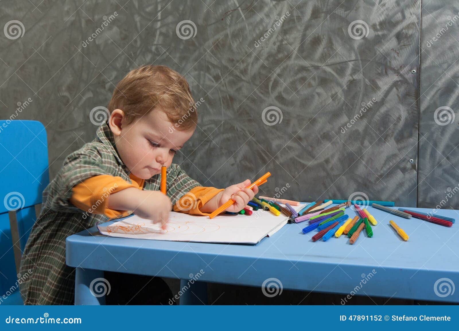Child Sitting at a Table Drawing Stock Photo - Image of making ...