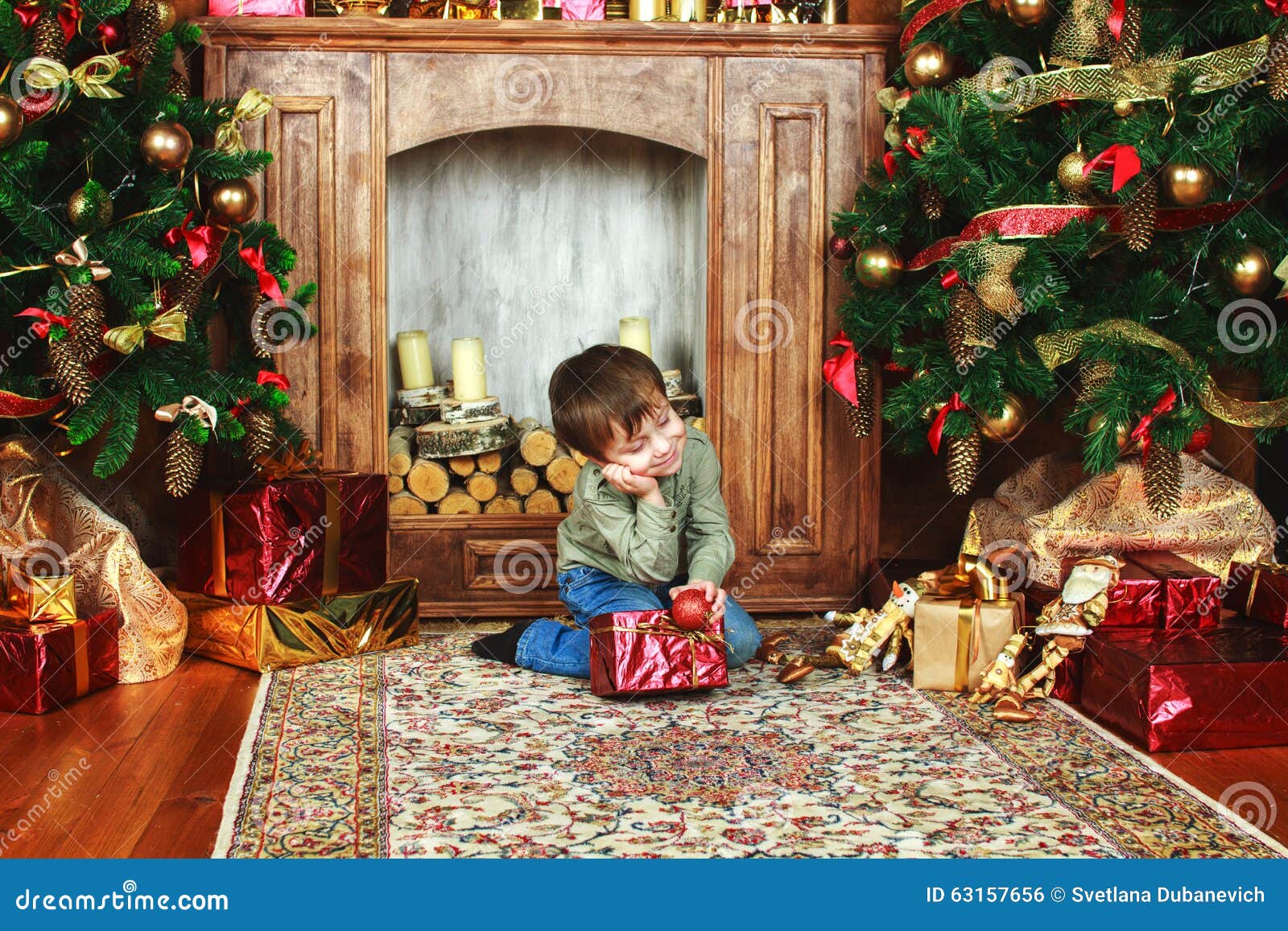 Child Sitting Under the Christmas Tree with Gifts Stock Photo - Image ...