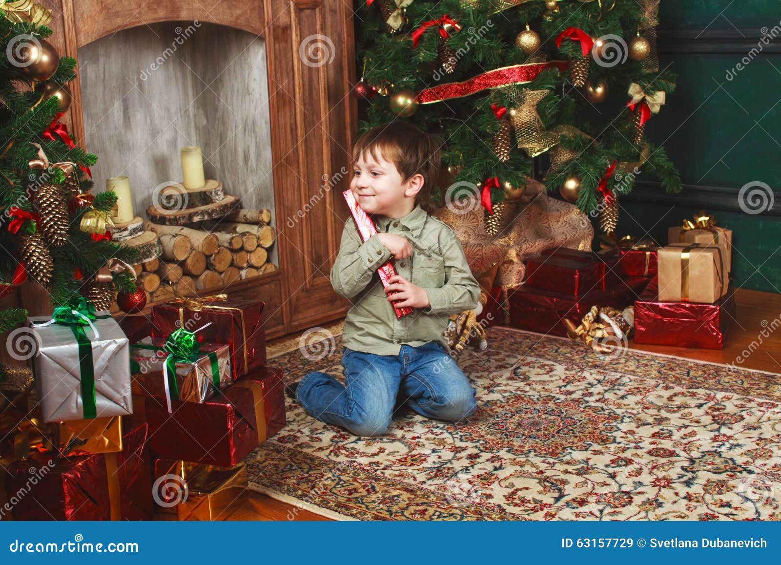 Child Sitting Under the Christmas Tree with Gifts Stock Image - Image ...