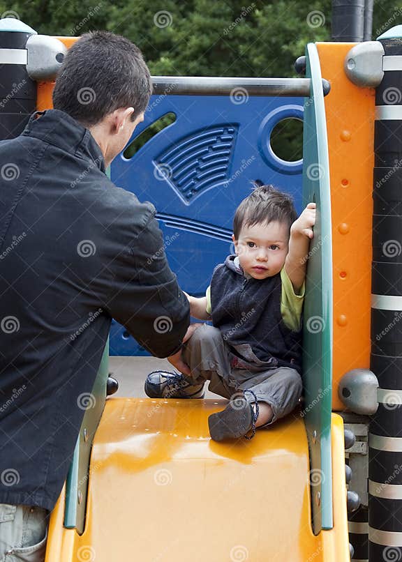 Child on a slide stock image. Image of playground, parent - 17258955
