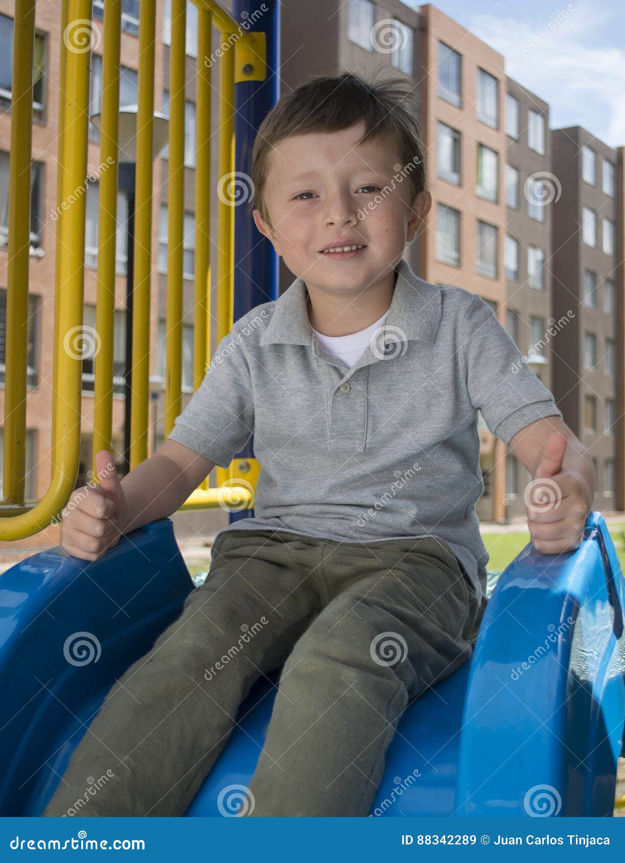 Child on Slide in an Outdoors Playground. Stock Image - Image of little ...