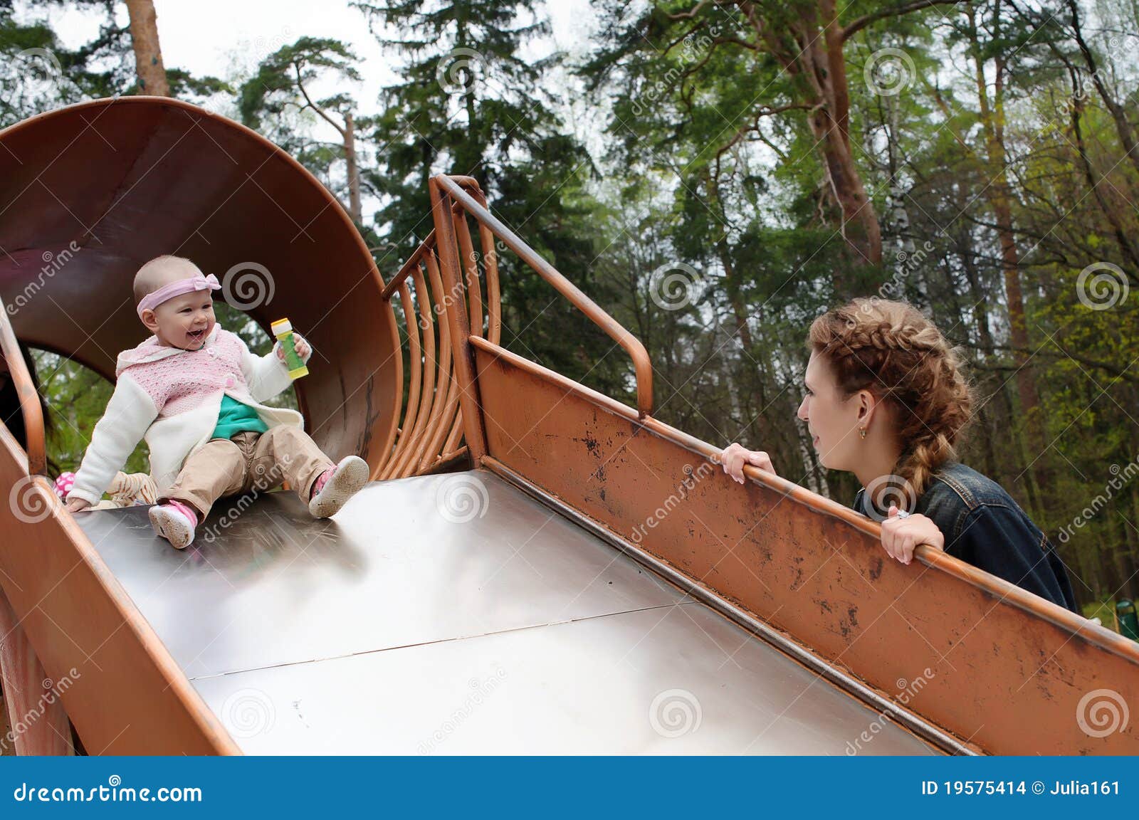 Child Sliding Down the Hill Stock Photo - Image of smile, child: 19575414
