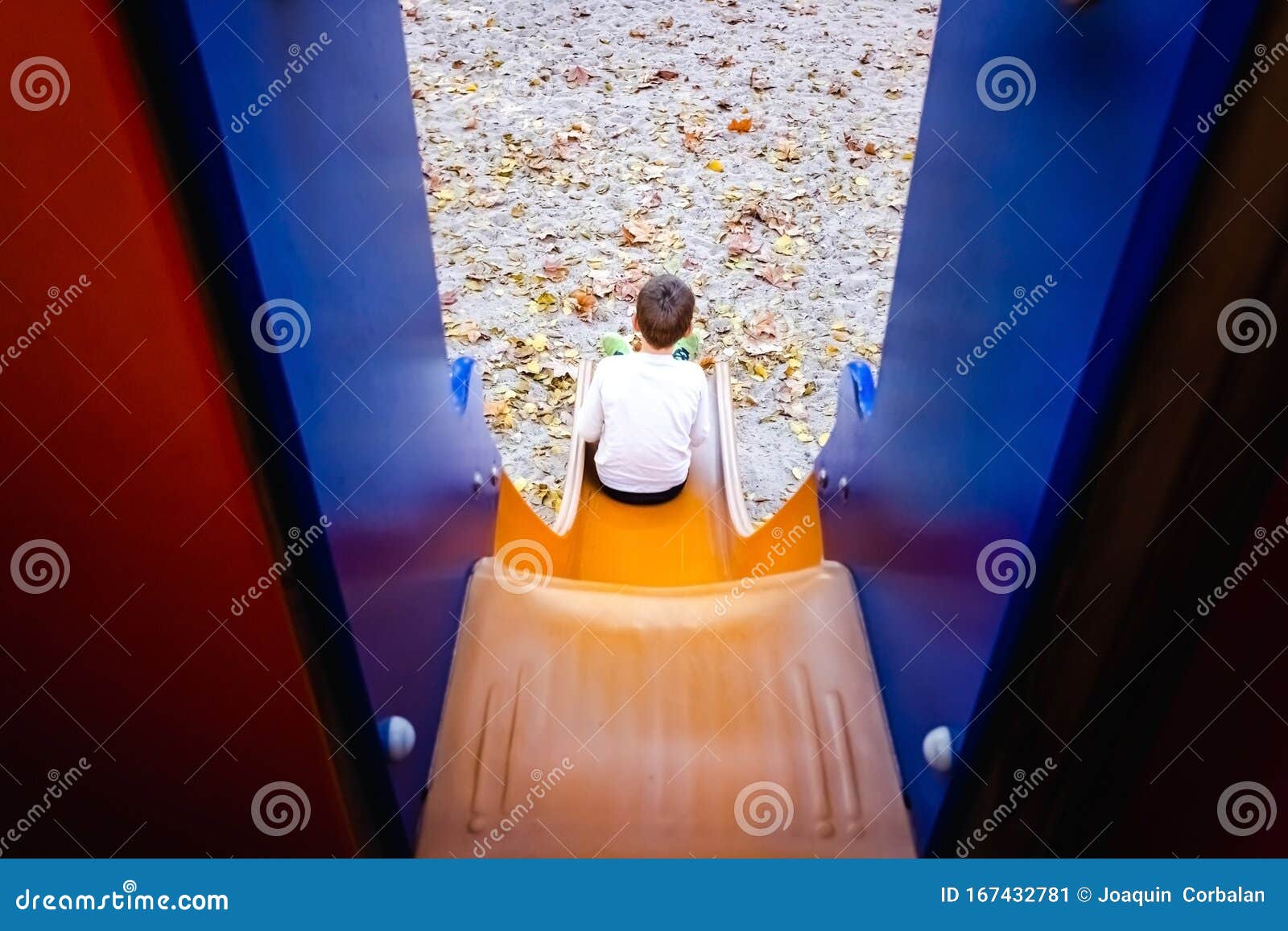 Child Sliding Down a Slide, Seen from the Back from Above Stock Image ...