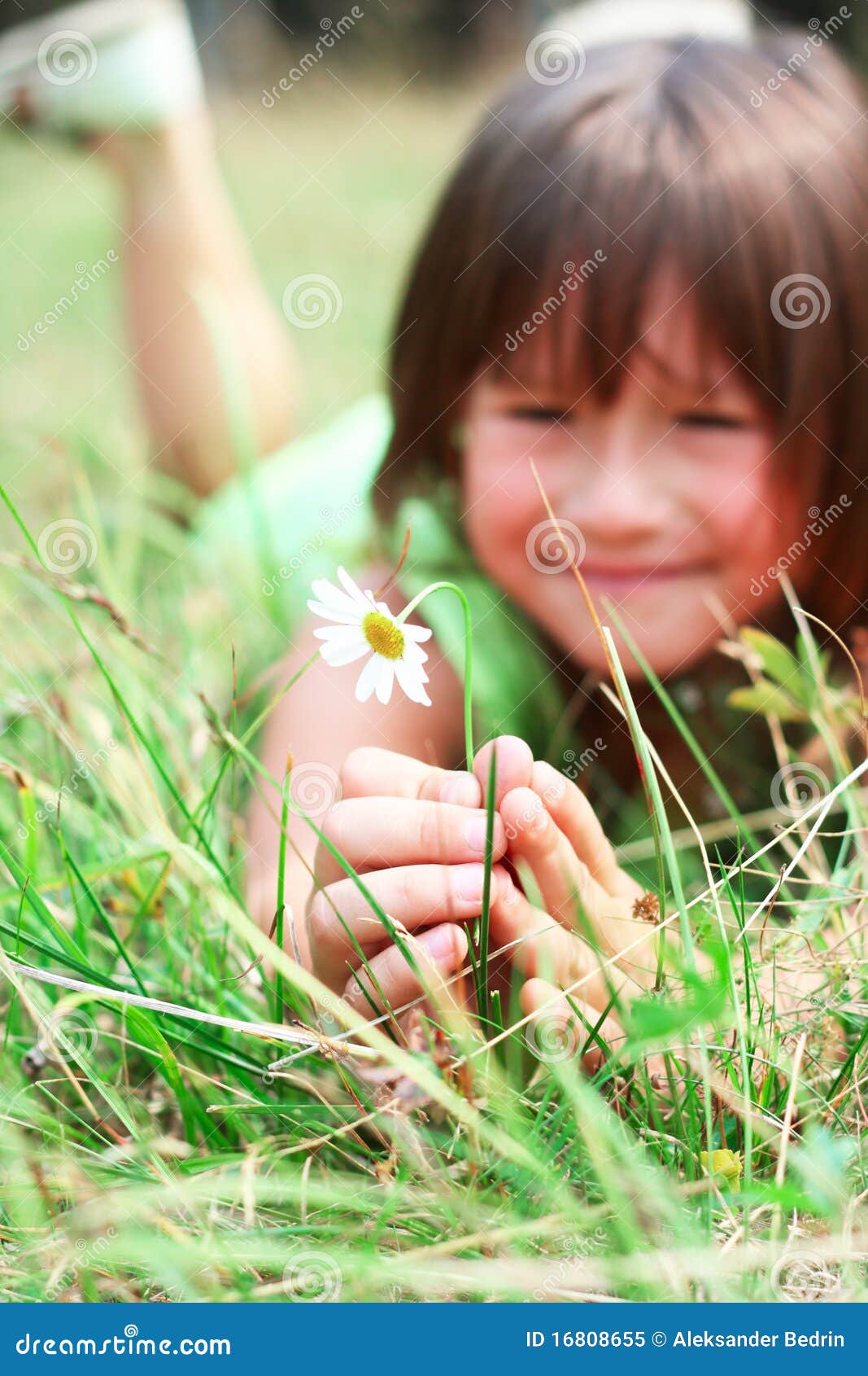 The child is smiling stock image. Image of camomile, holding - 16808655