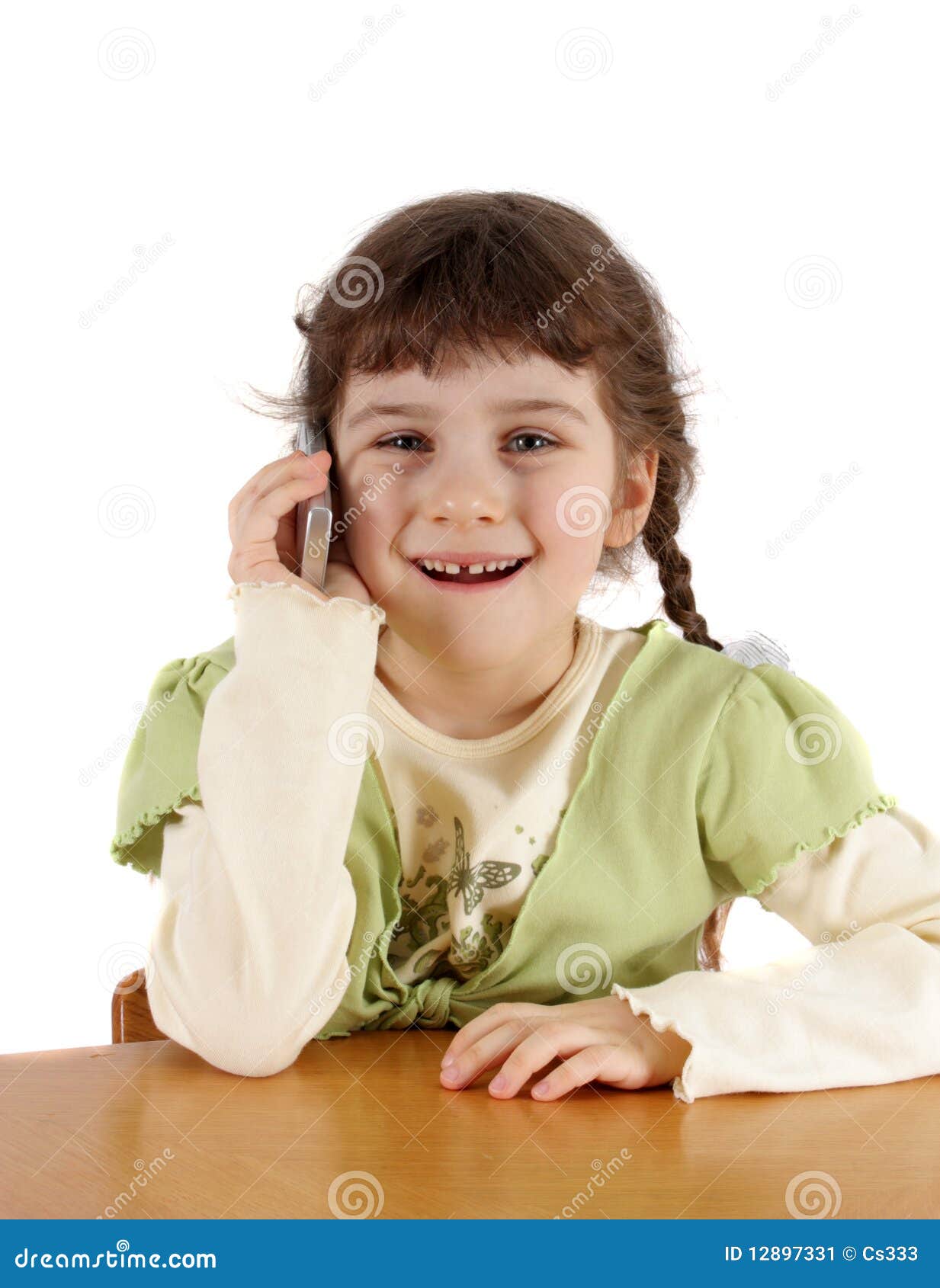 Child Speaks by a Mobile Phone Stock Image - Image of child, girl: 12897331