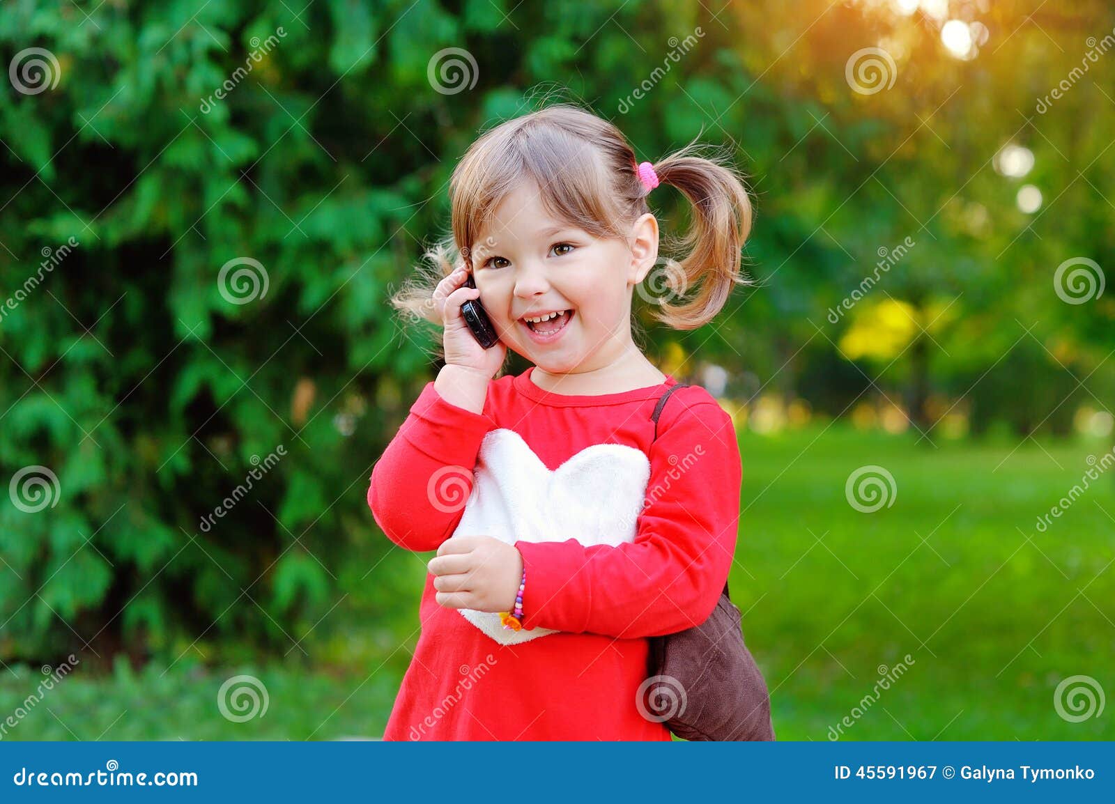 Child Speaks on the Phone in the Park Stock Image - Image of care, look ...