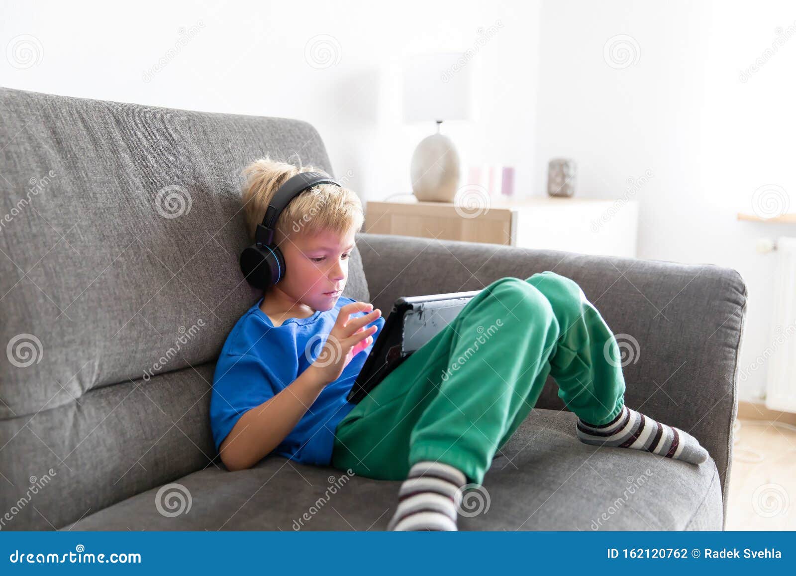 Little Boy Playing on Tablet Stock Photo - Image of childhood ...