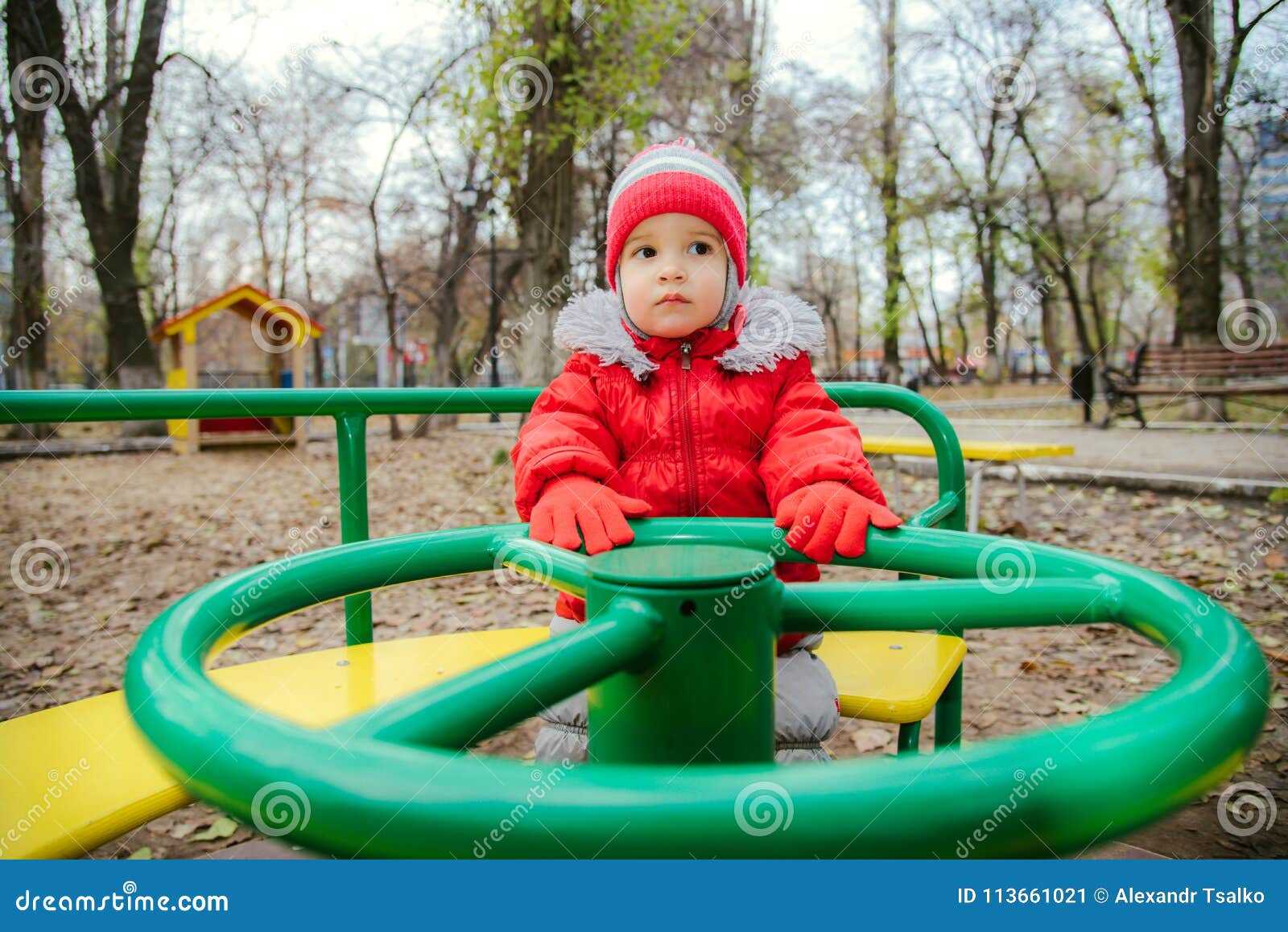 The Child is Spinning on a Swing in the Playground in the Park Stock ...