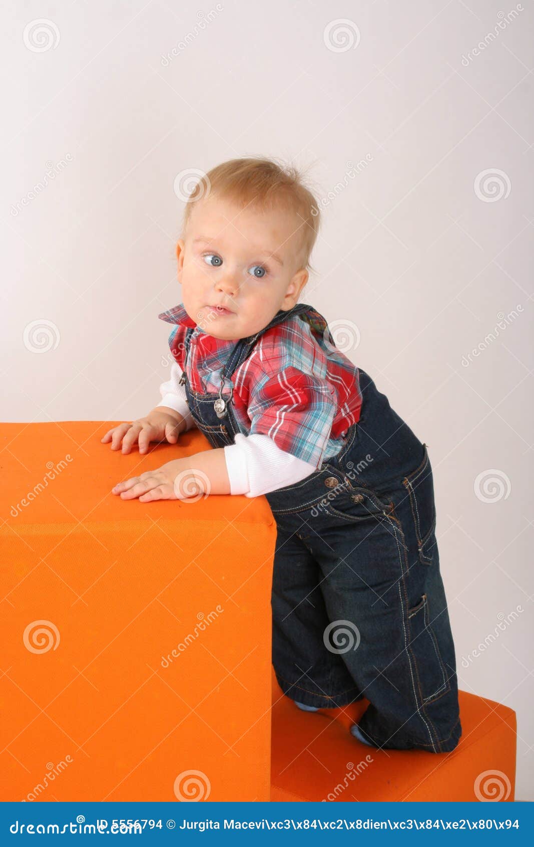 Child standing stock photo. Image of orange, emotion, cute - 5556794
