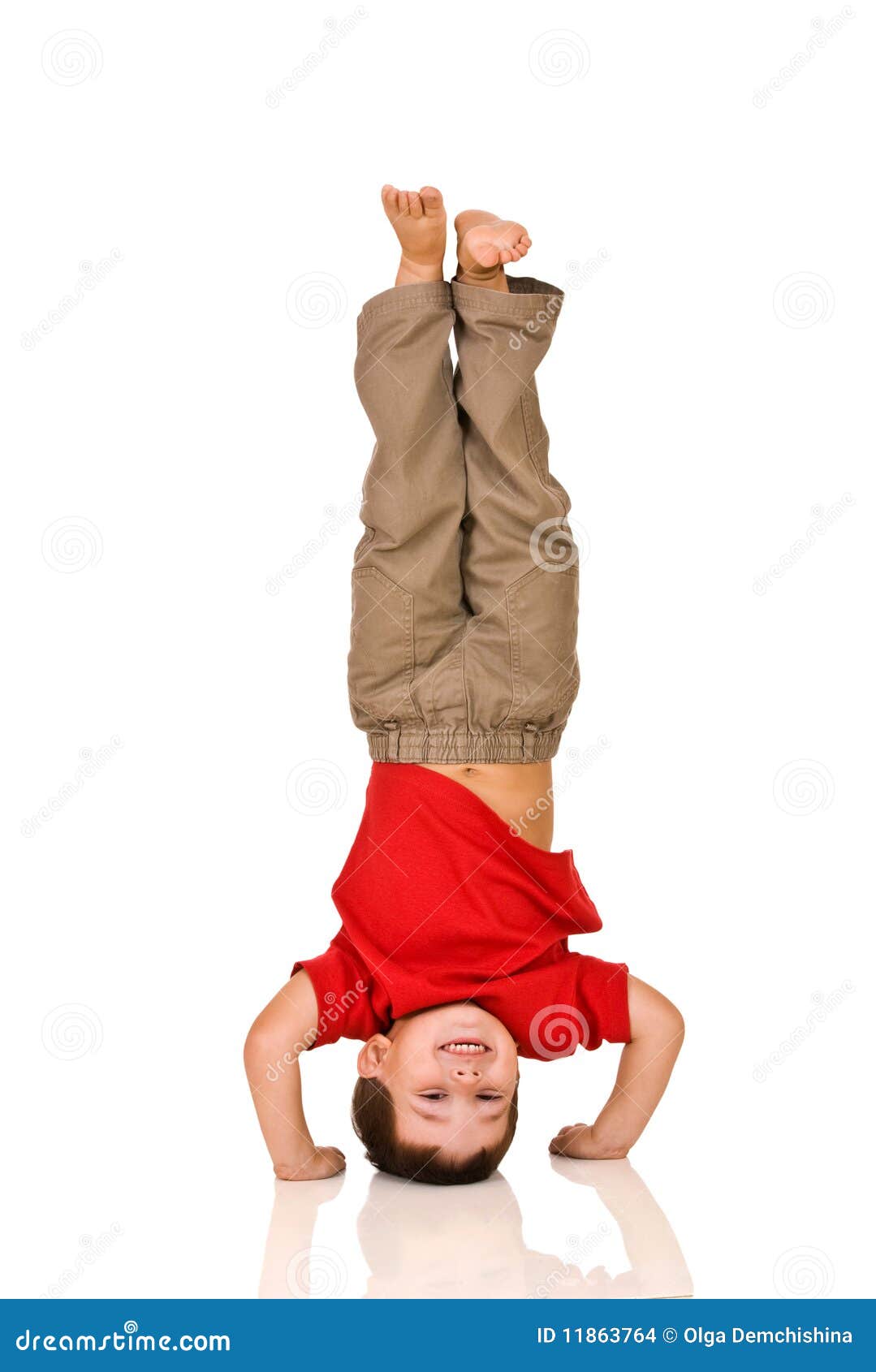 Child standing on his arms stock photo. Image of expression - 11863764