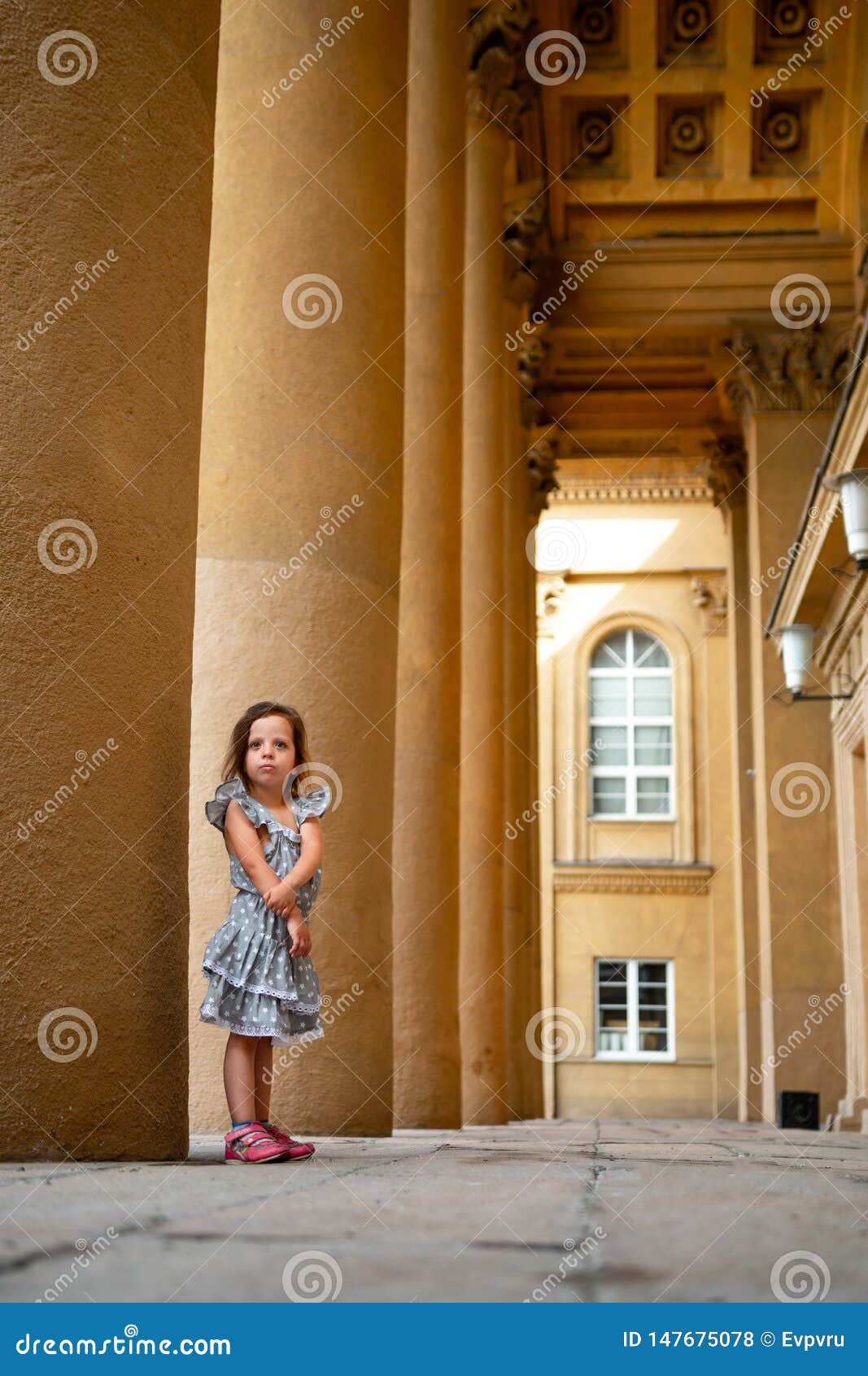The Child is Standing Near a Column Stock Photo - Image of child, space ...