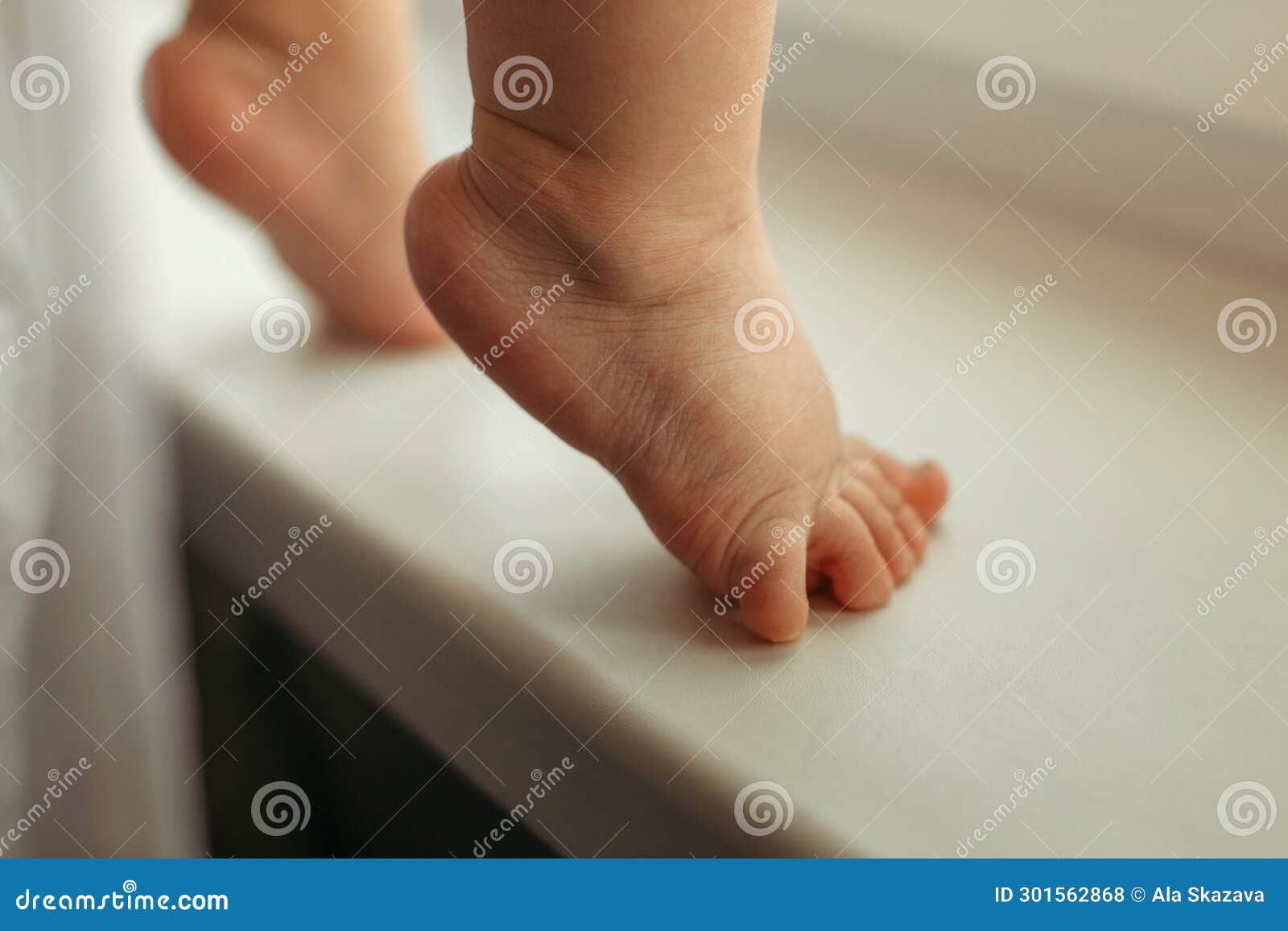 The Child Stands on the Windowsill, the Child’s Legs are Close-up Stock ...