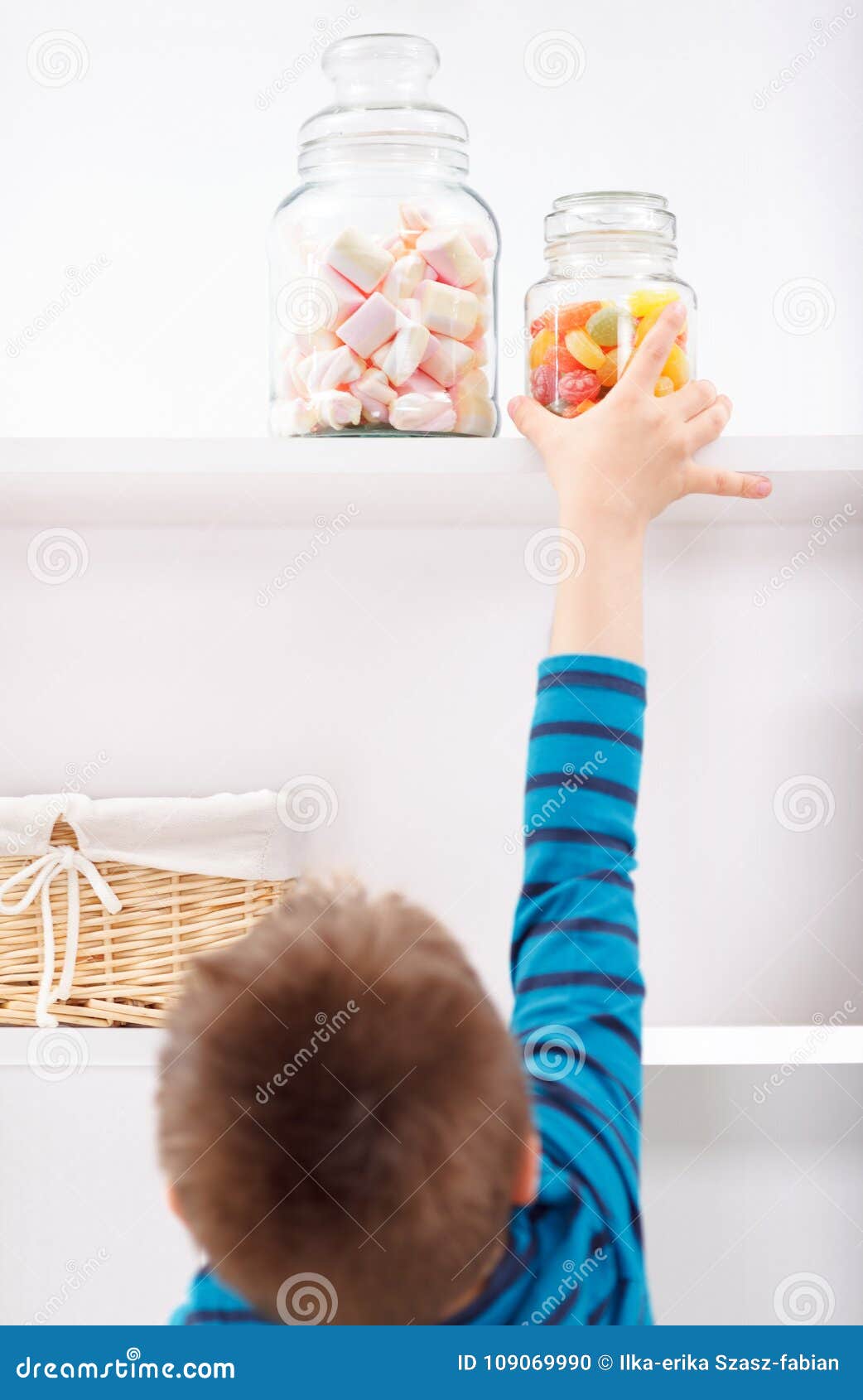 Child Stealing Candy from the Shelf Stock Photo - Image of furniture ...