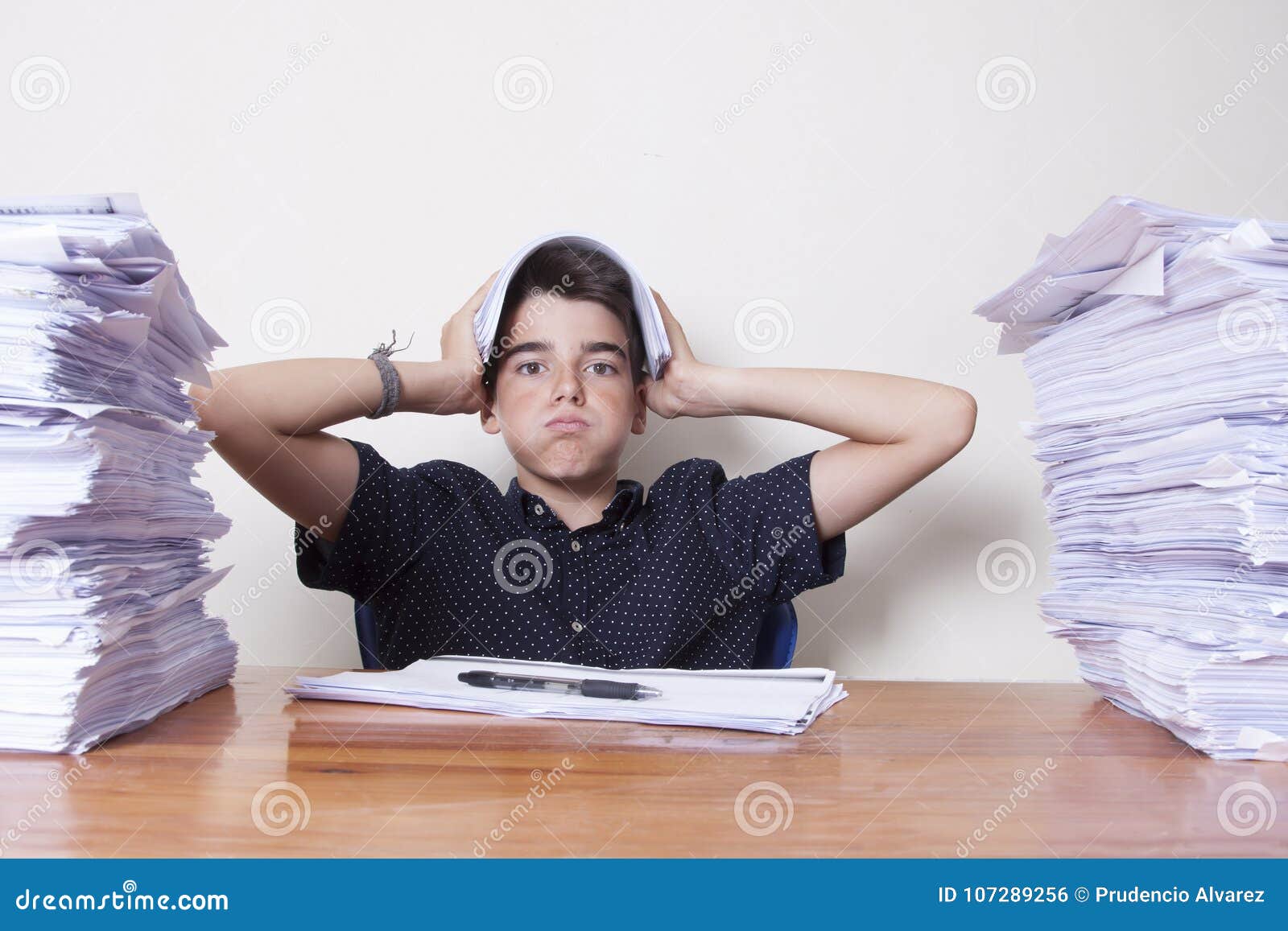 Child student on the desk stock photo. Image of emotions - 107289256