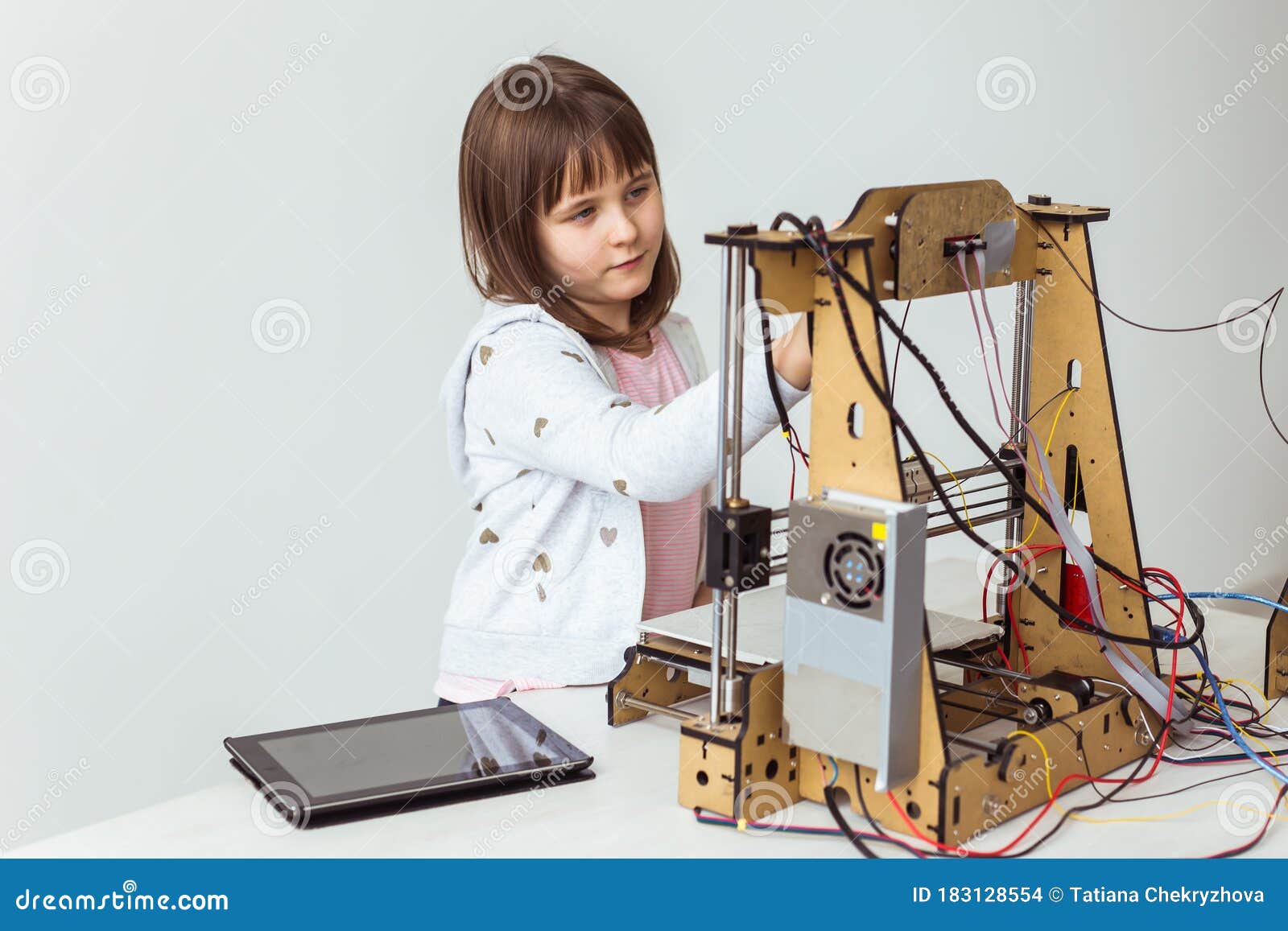 Child Student Makes the Item on the 3D Printer. School, Technologies ...