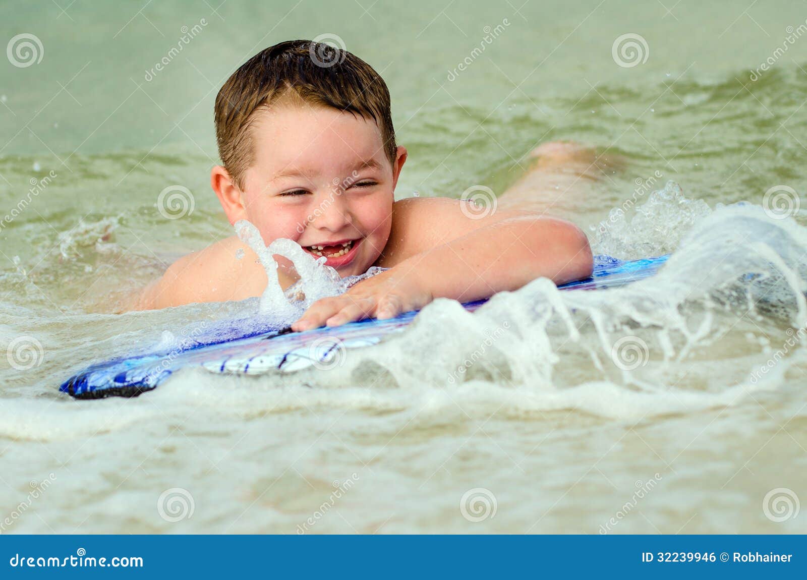 Child Surfing on Bodyboard at Beach Stock Photo - Image of recreation ...