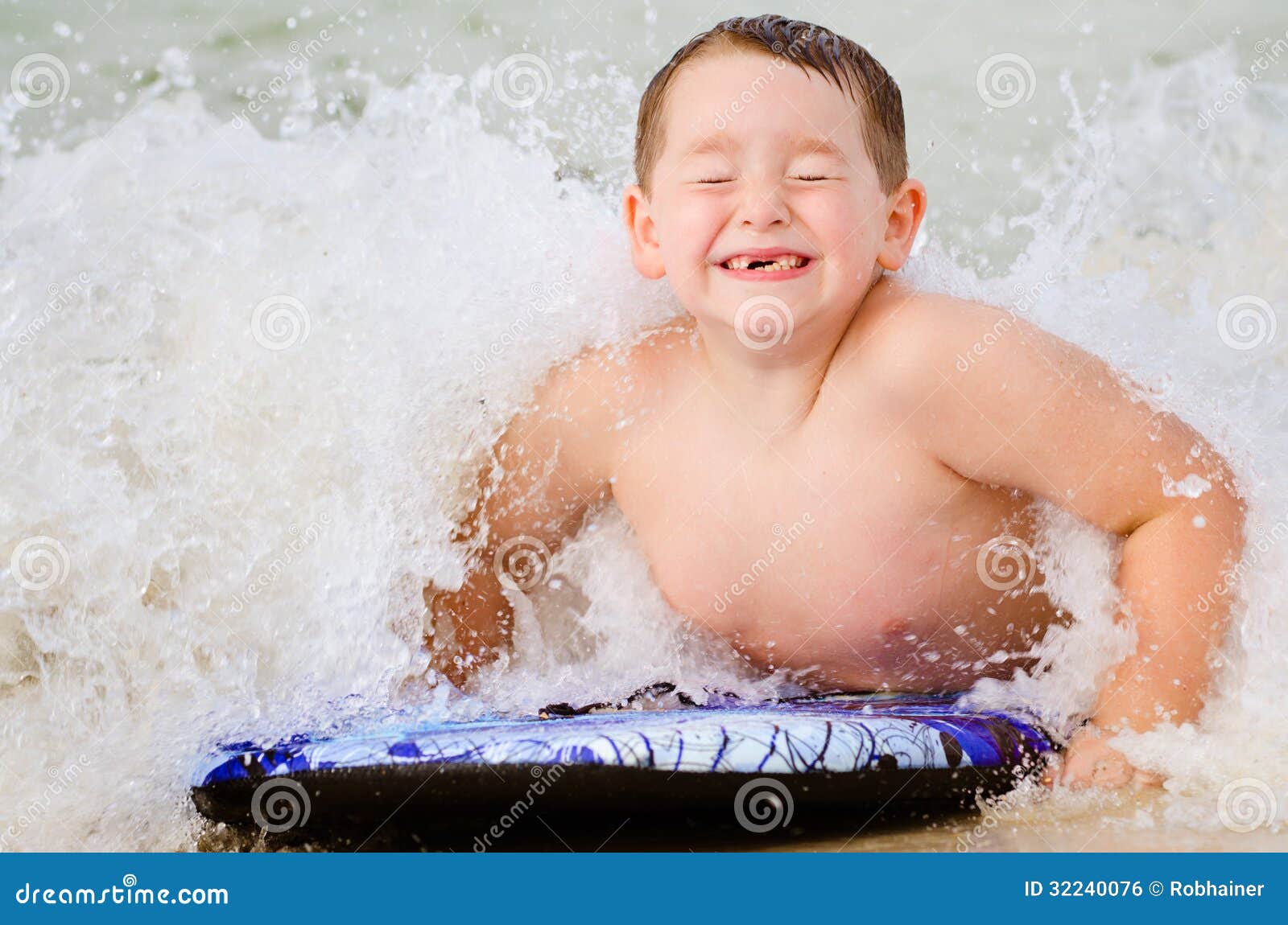 Child Surfing on Bodyboard at Beach Stock Photo - Image of person ...